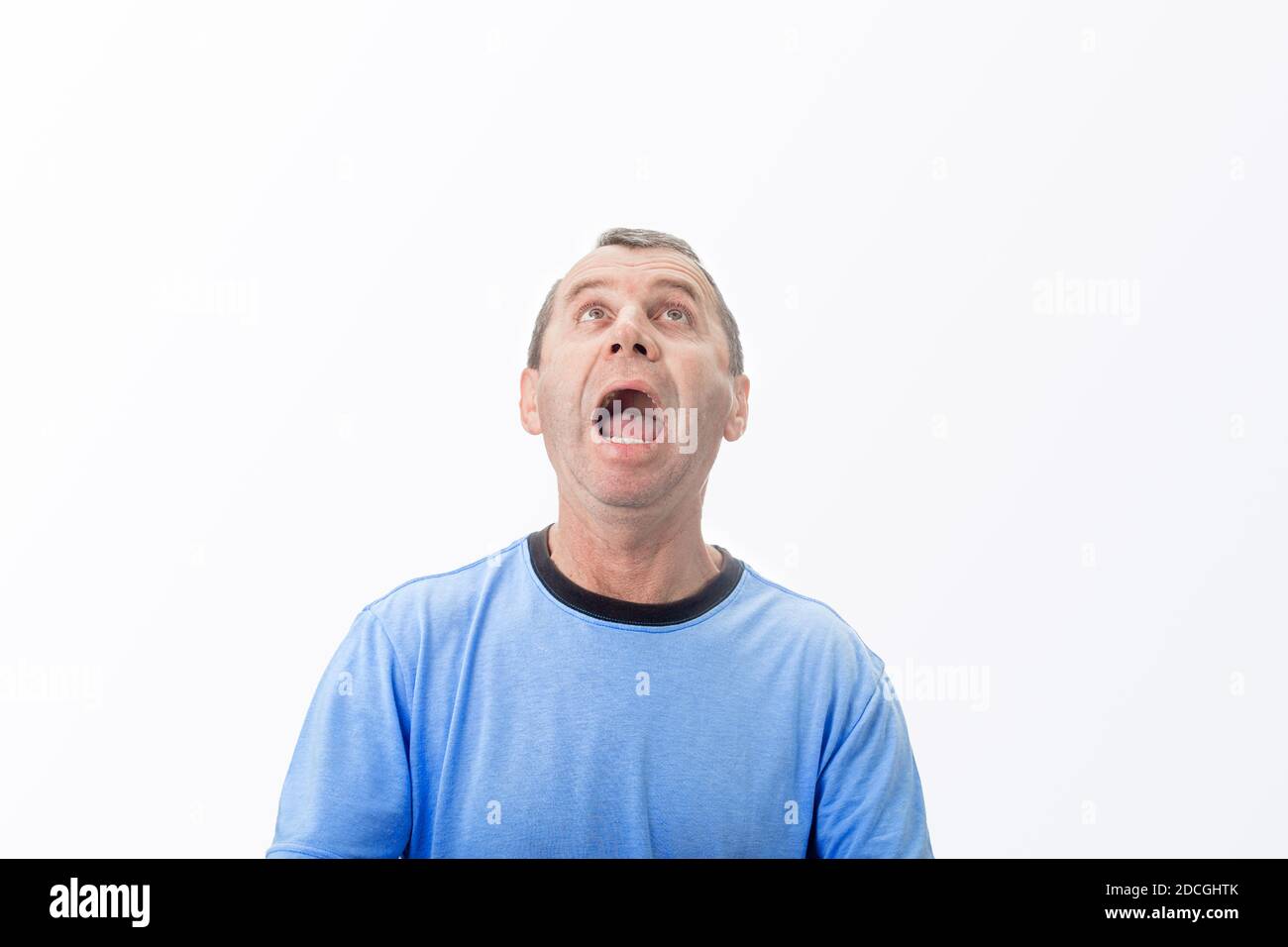 Angry middle aged man screaming yelling isolated over white background ...