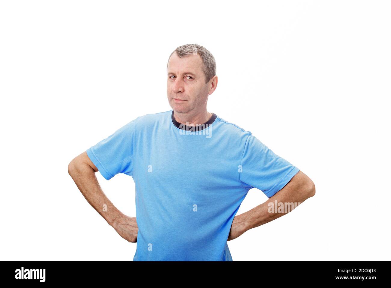 Middle age man feeling grumpy over white background. Portrait of ...