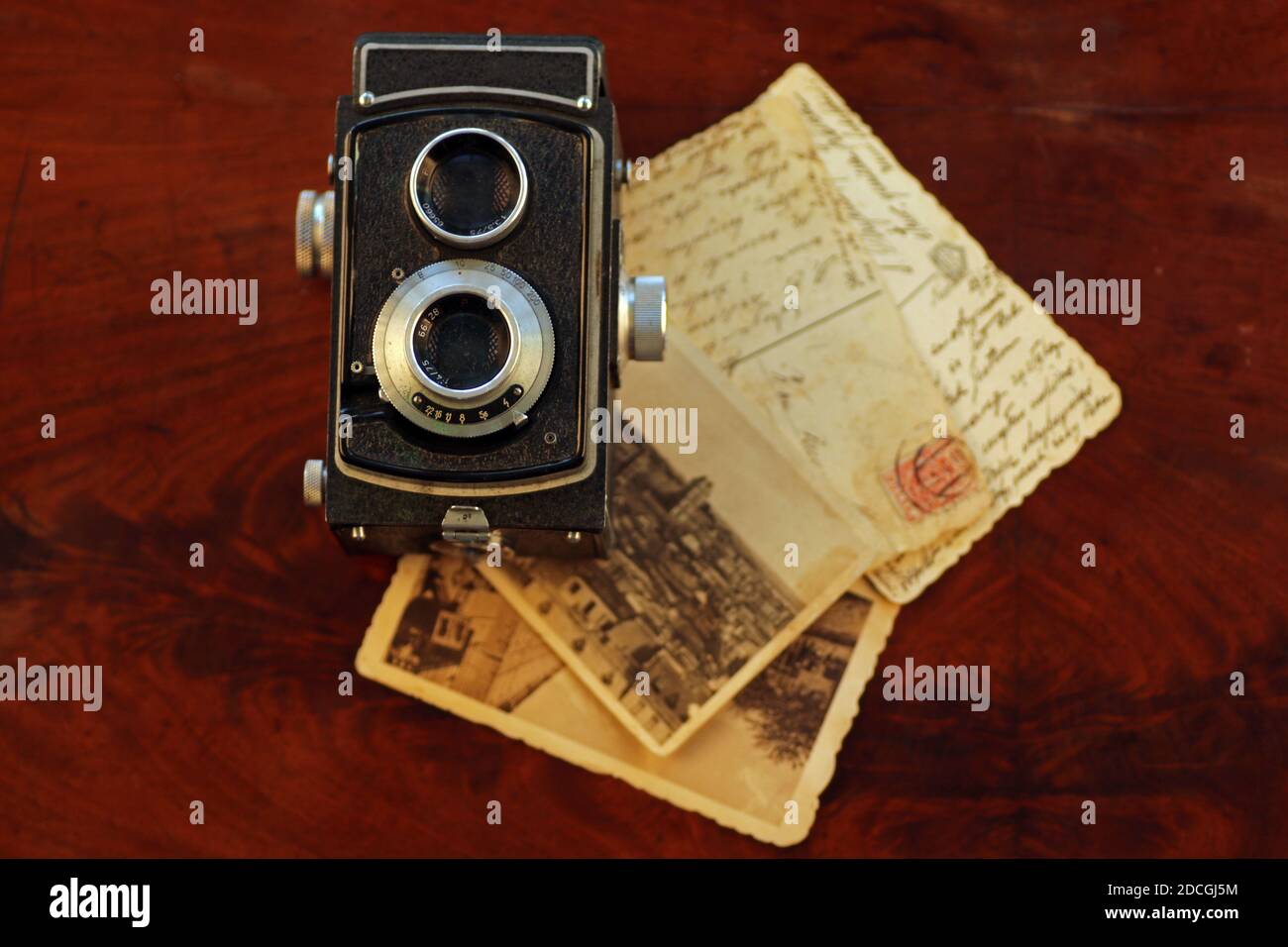 Old, vintage TLR camera - twin lens reflex and old postcards Stock ...
