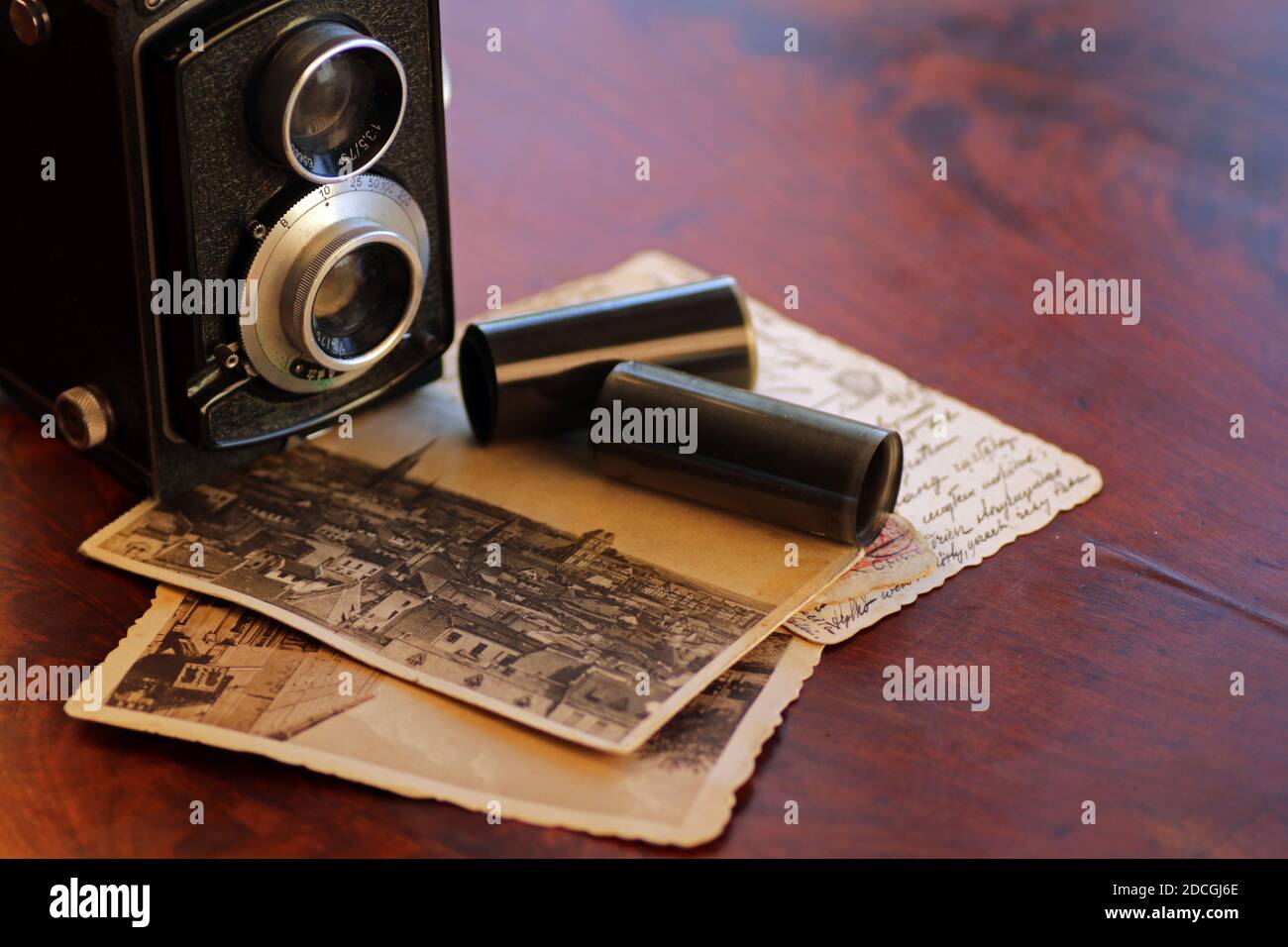 Old, vintage TLR camera - twin lens reflex and old postcards Stock ...
