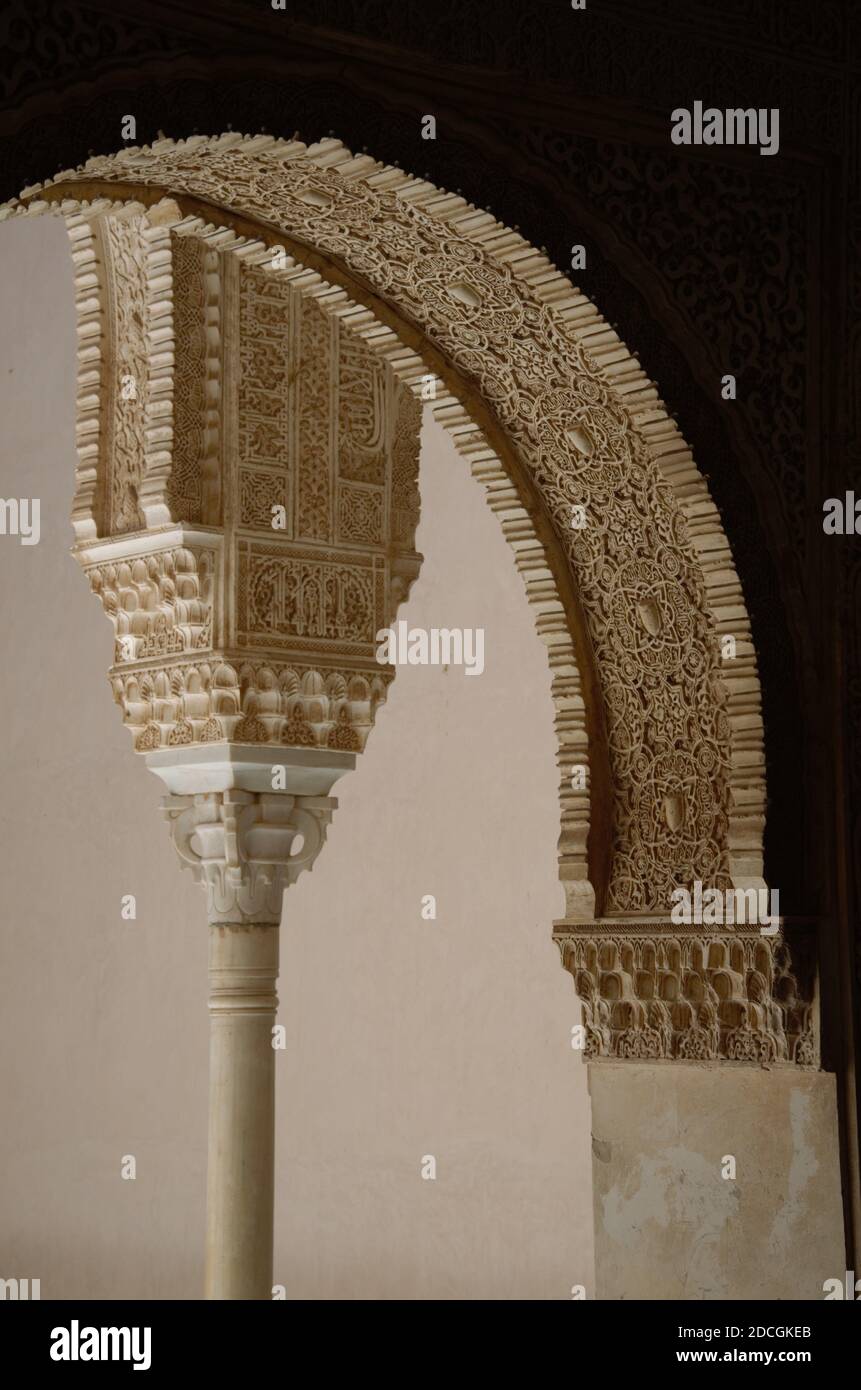 Column and arch decorated with Arabesque pattern in the Alhambra ...