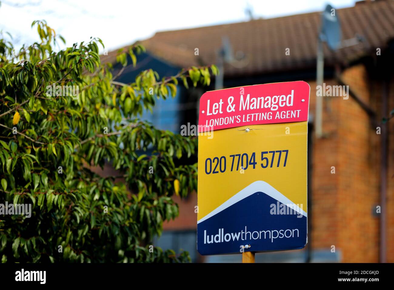 A ÔLet and ManagedÕ estate agent board sign erected outside a property ...