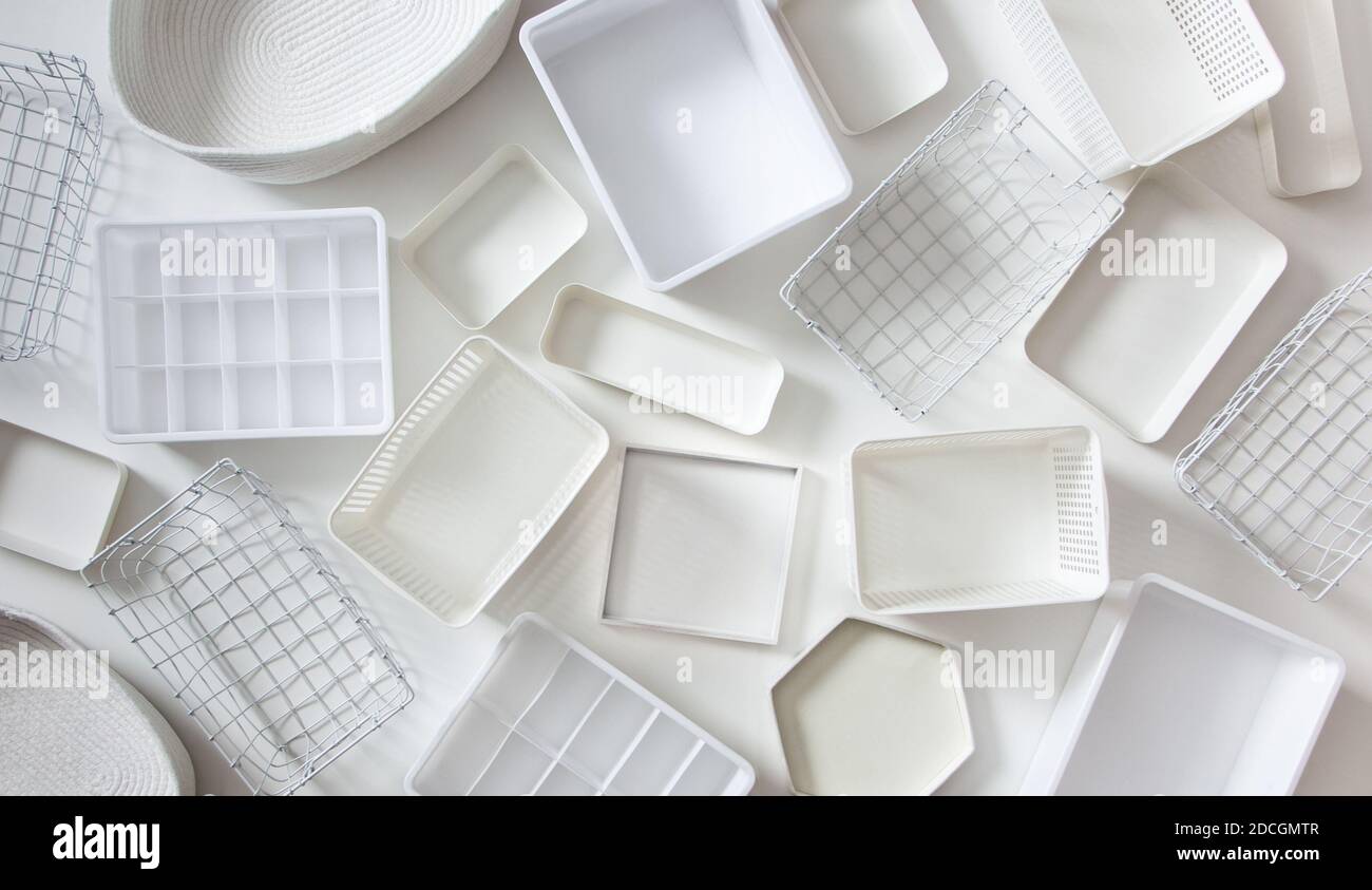 Flat lay of Marie Kondo's white storage boxes, containers and baskets ...