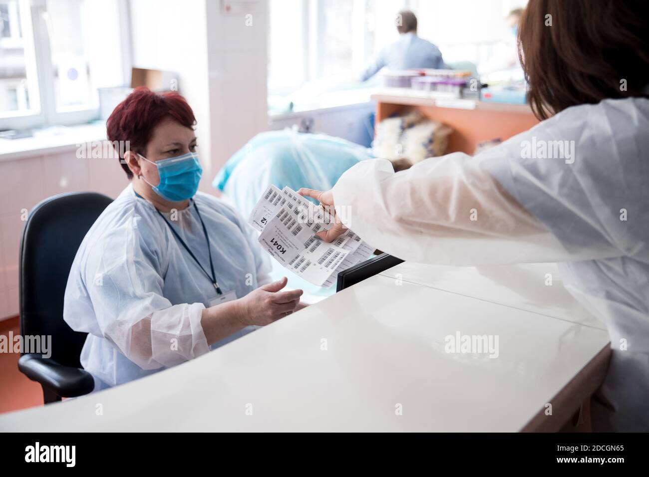 Medical technicians at work processing blood plasma from COVID-19 ...