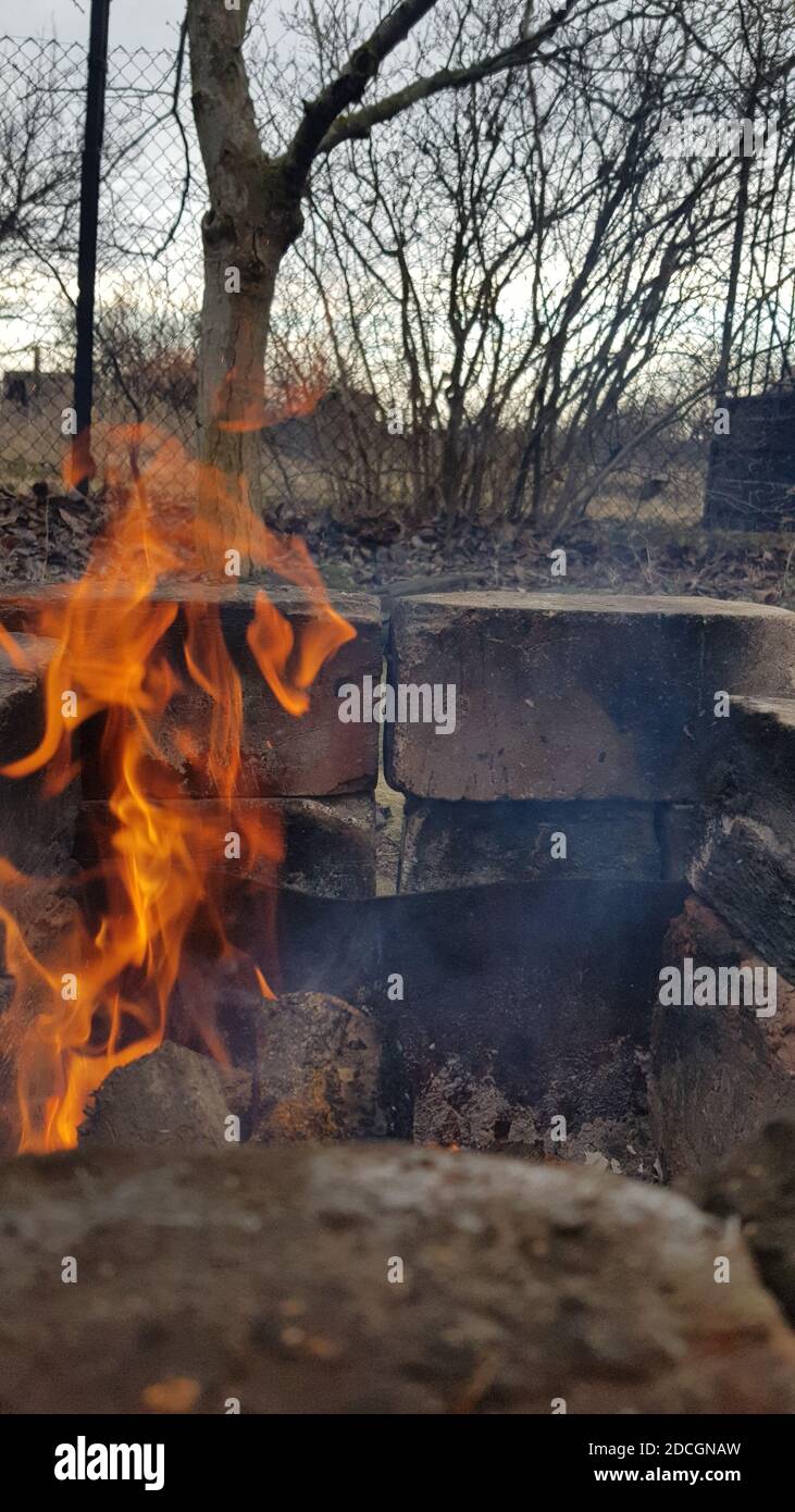 Fire is flaming with rural landscape background. Grunge textures ...