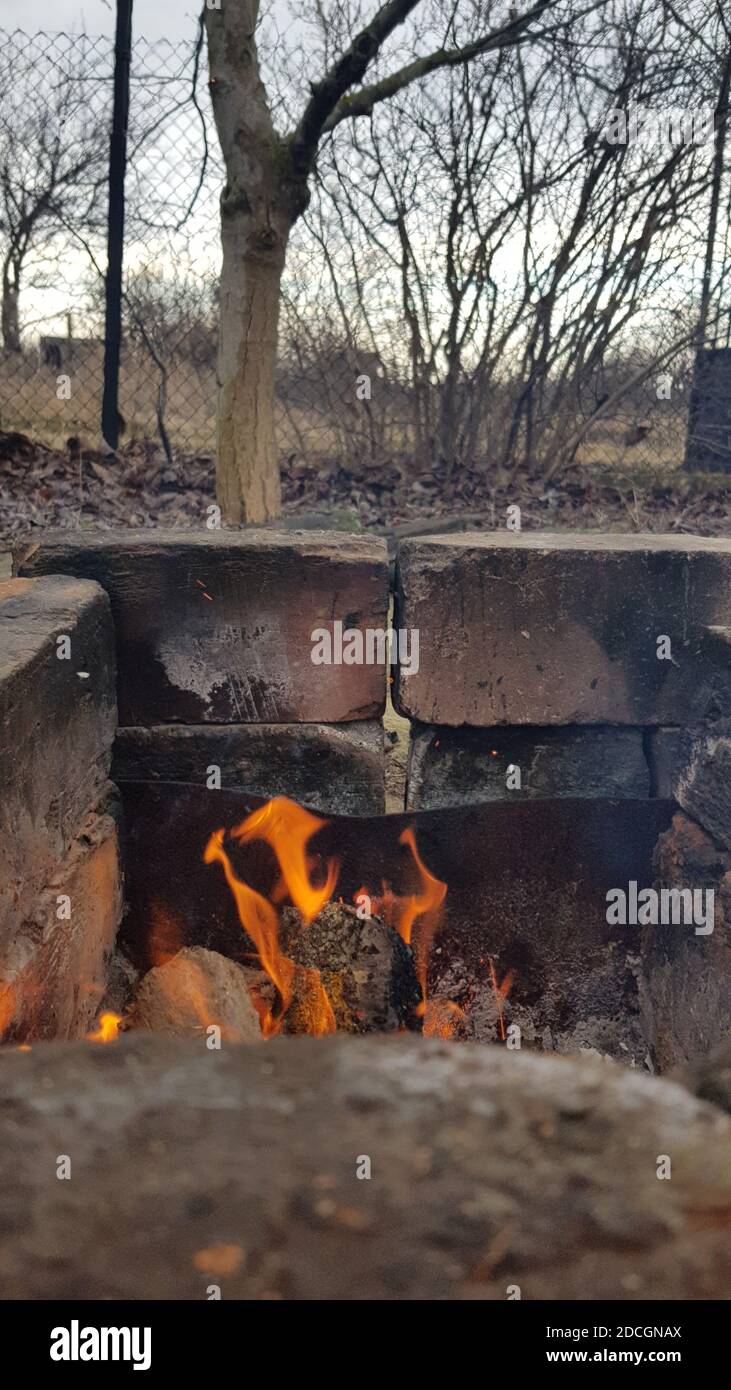 Fire is flaming with rural landscape background. Grunge textures ...