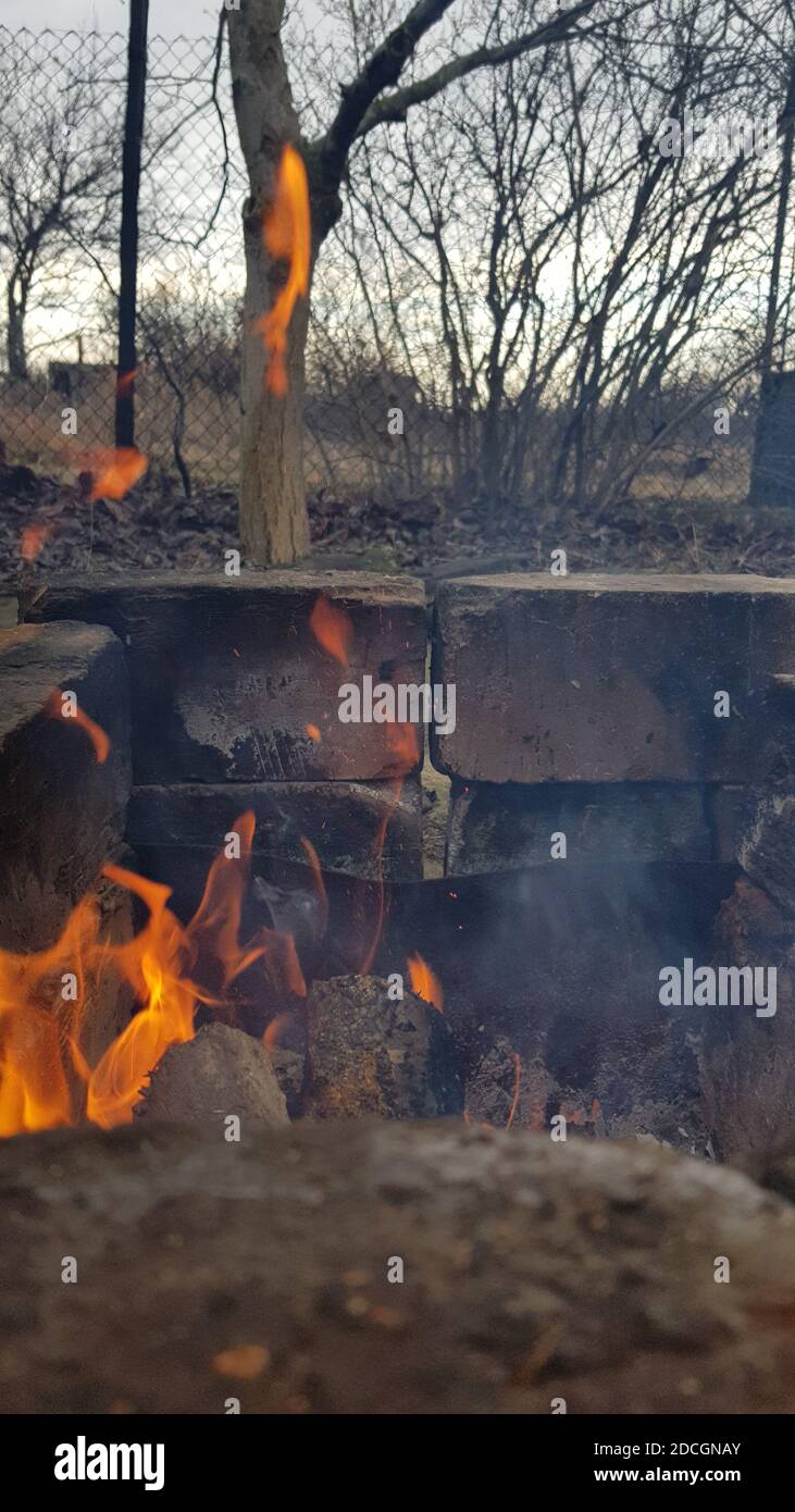 Fire is flaming with rural landscape background. Grunge textures ...