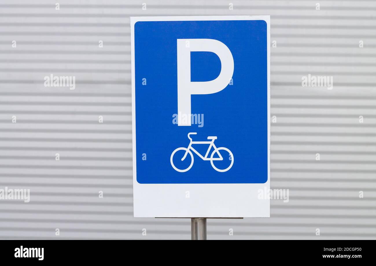 Bicycle parking sign showing parking space for bikes in public park ...