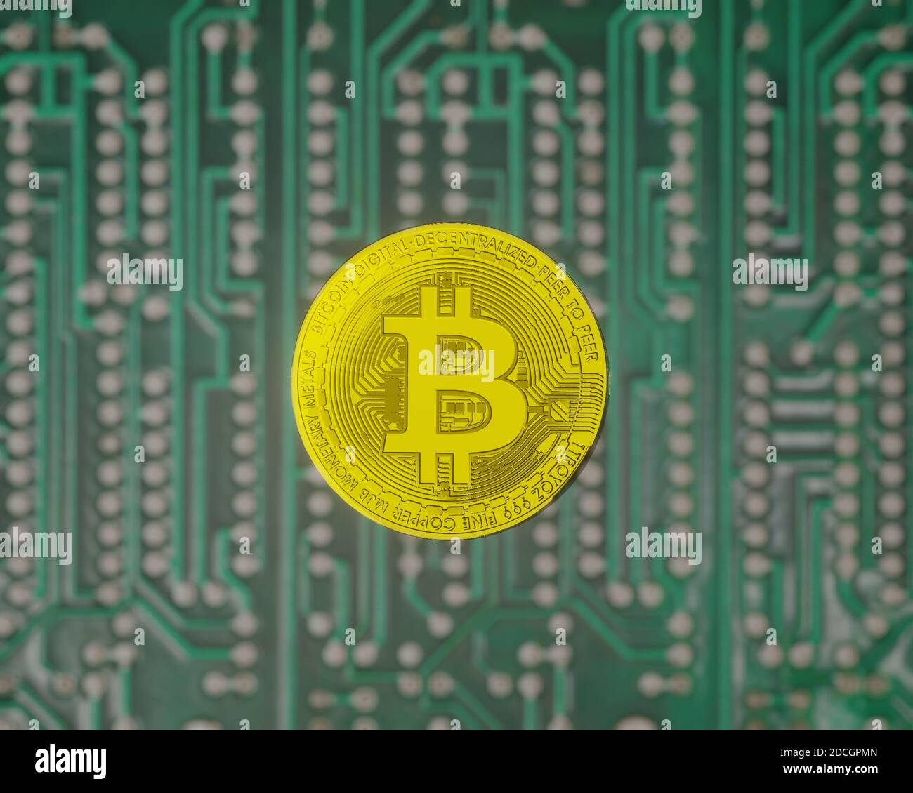 Bitcoin gold coin on PCB electronics background. Cryptocurrency concept ...