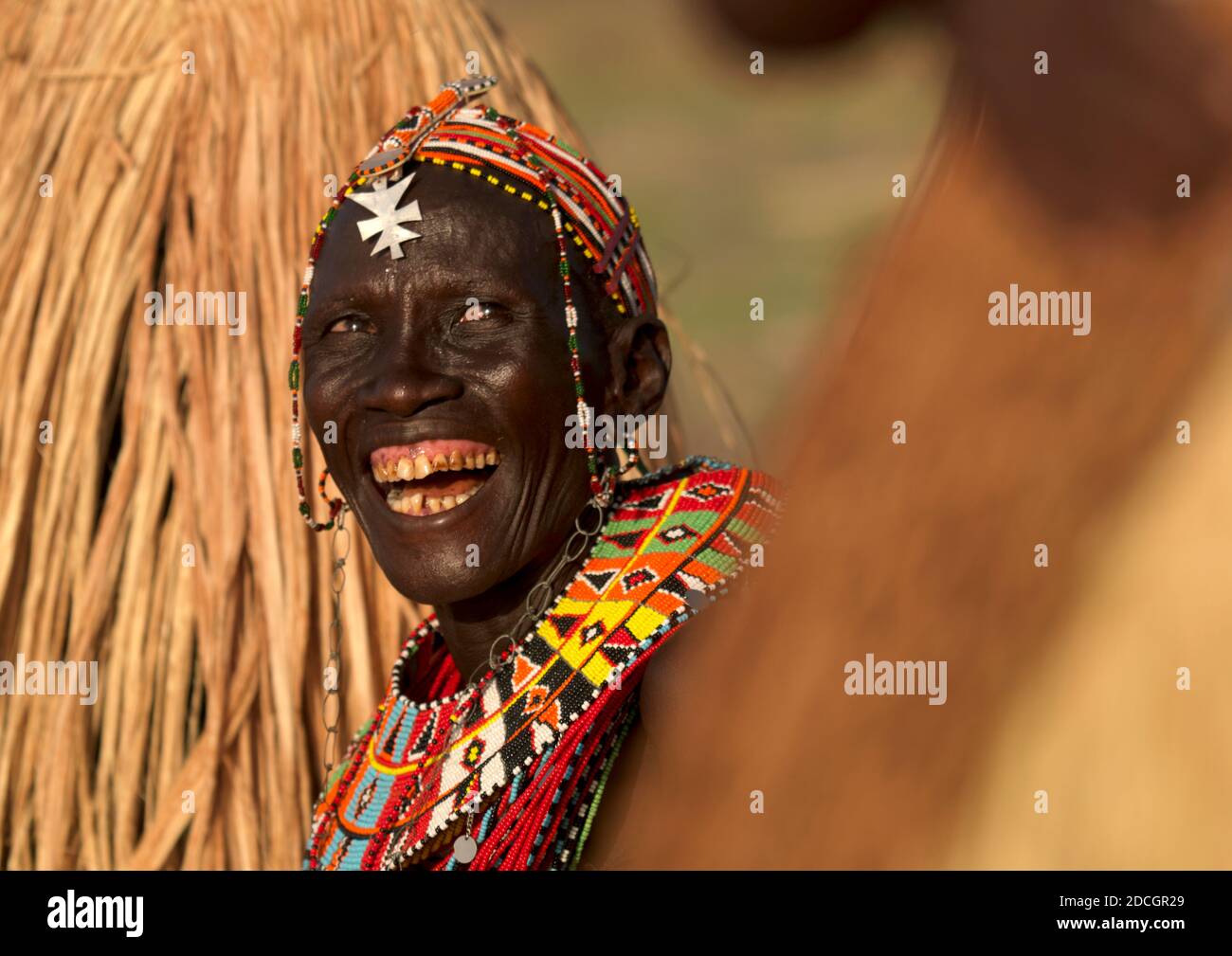Portrait of a laughing El Molo tribe woman, Rift Valley Province ...