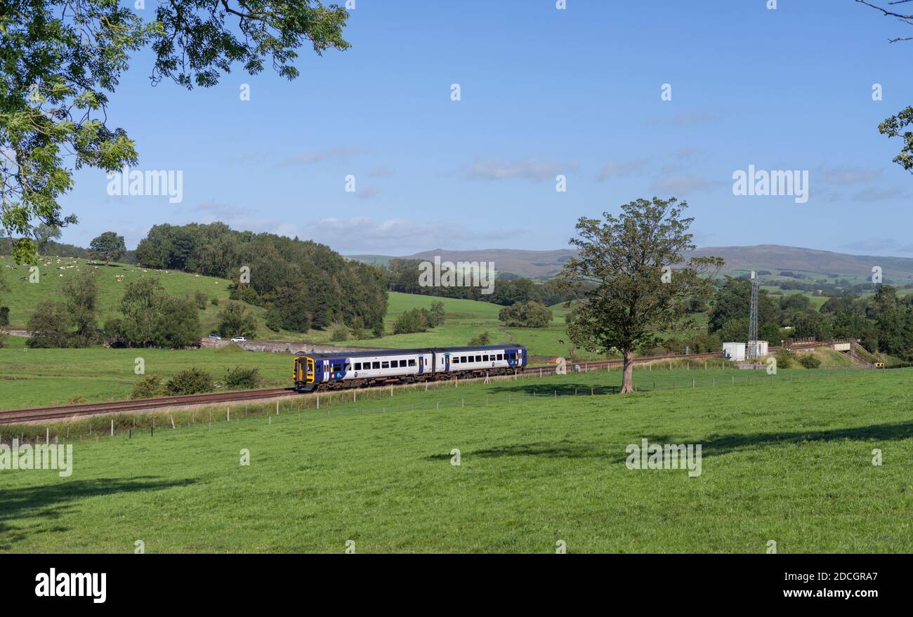 Northern Rail class 158 diesel train passing through the Aire valley countryside, Craven, North ...