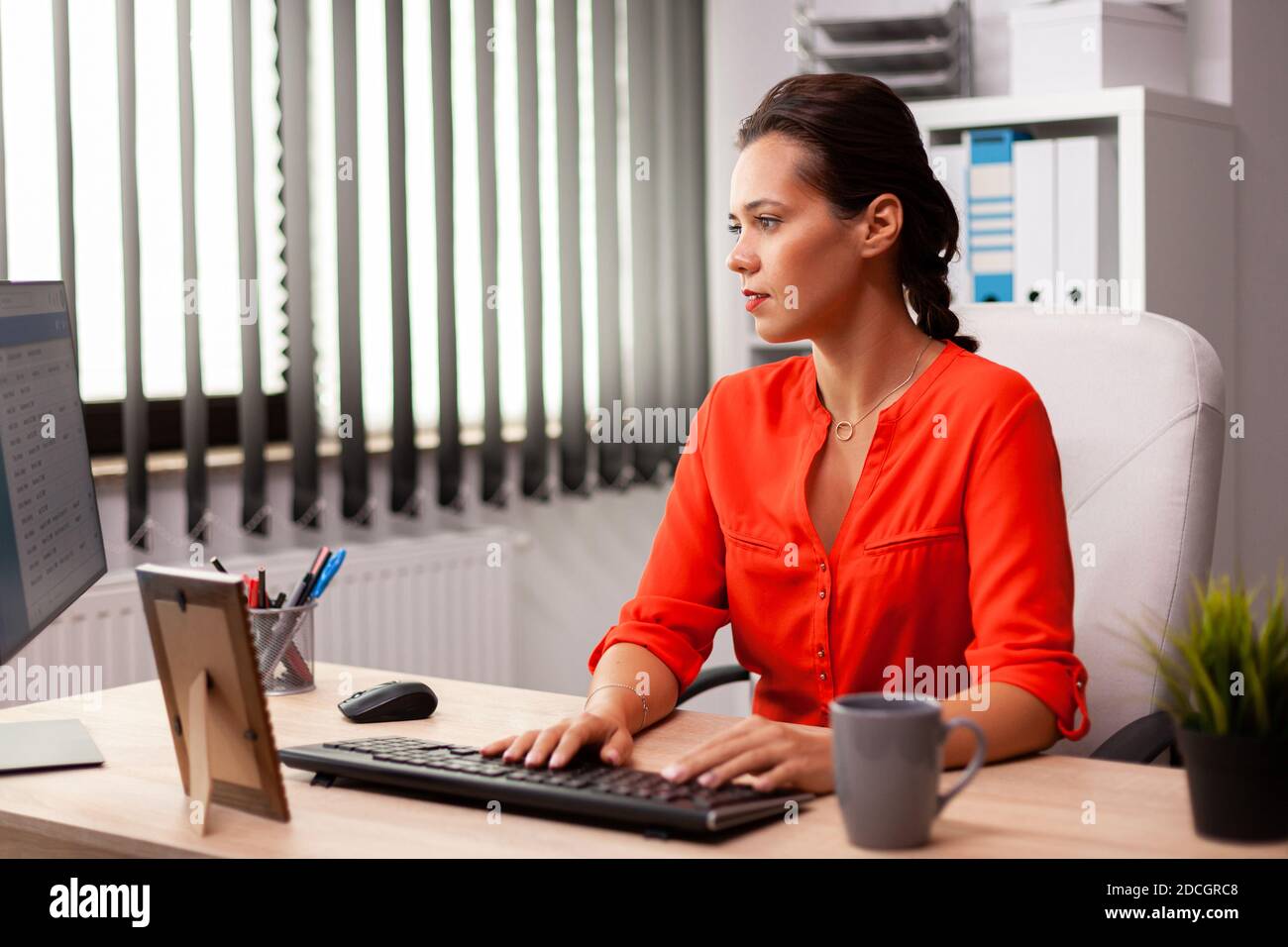Executive businesswoman in workplace office working on finance ...
