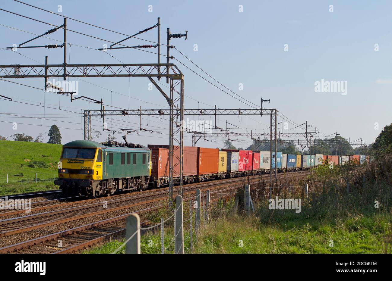 A Class 90 electric locomotive number 90046 working a well loaded ...