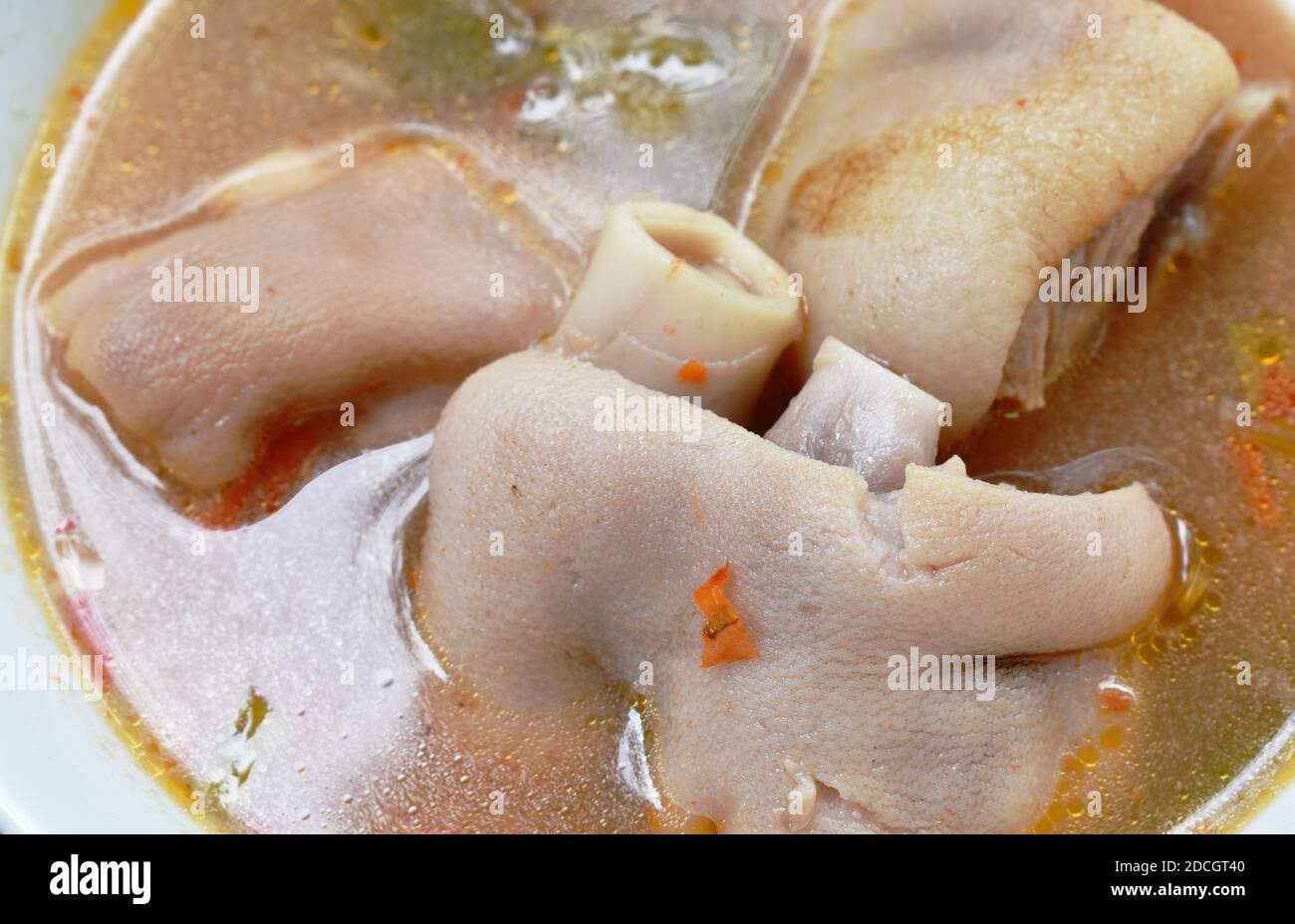 boiled spicy pork knuckle in tom yum soup on bowl Stock Photo - Alamy