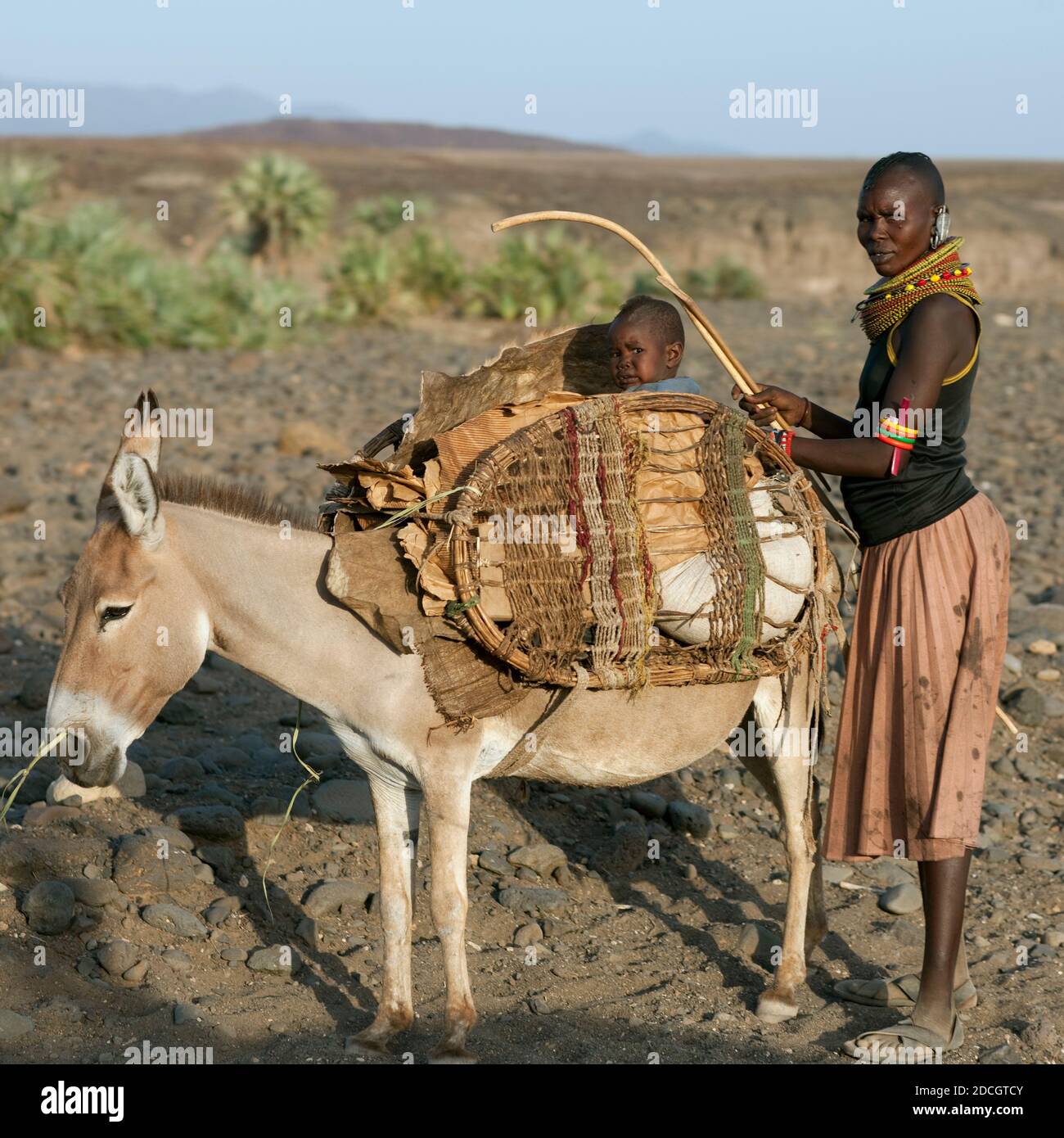 Rendille tribe woman with her baby sit a donkey, Rift Valley Province ...