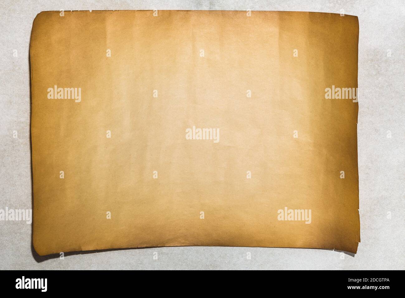 single old sheet of paper on white background Stock Photo - Alamy
