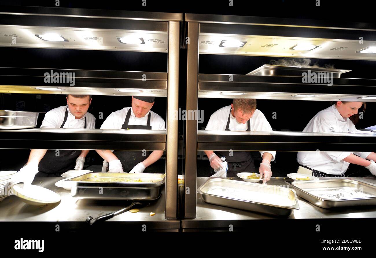 Chefs Working in Restaurant Kitchen Stock Photo - Alamy