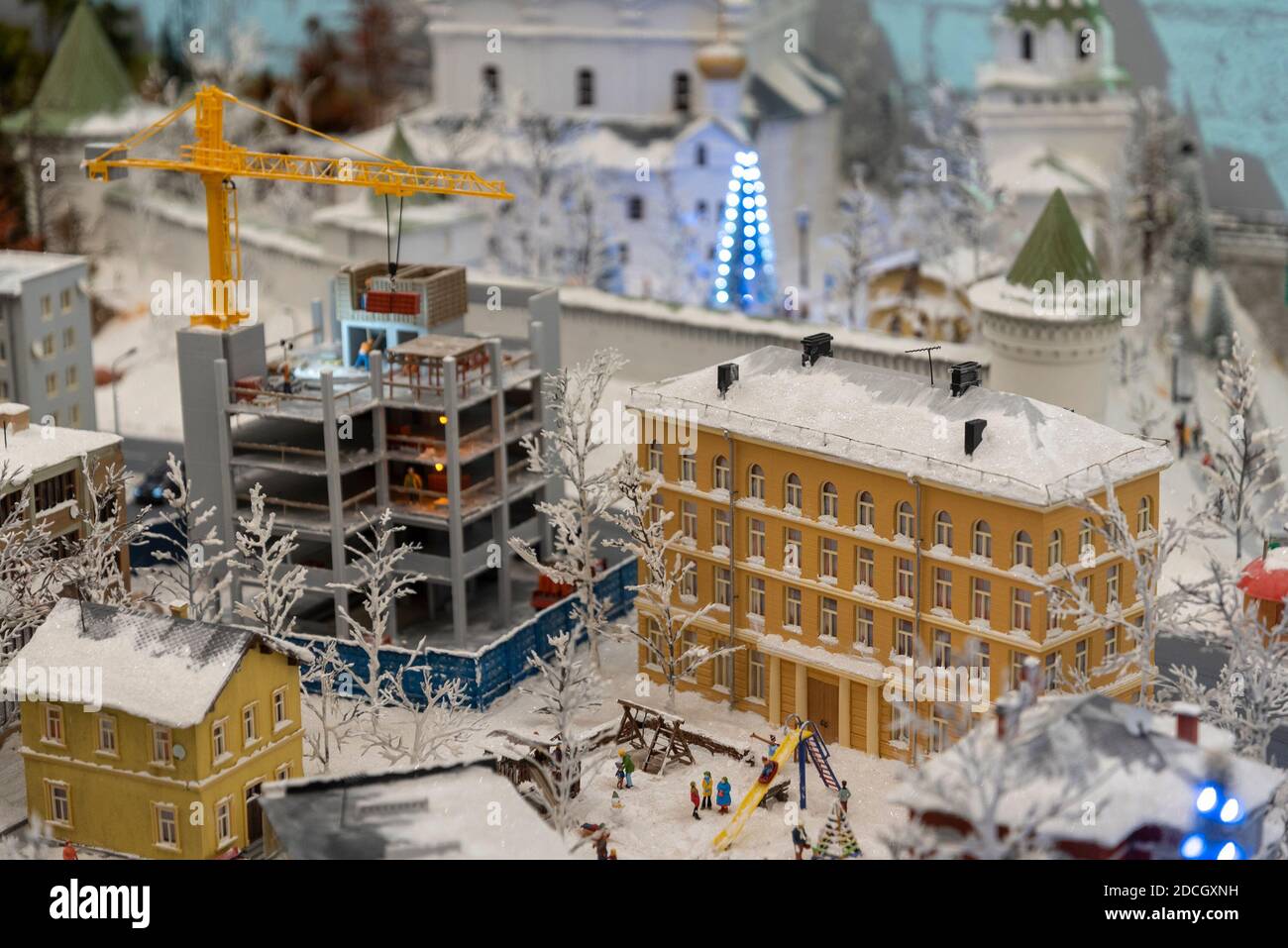 Miniature construction of a high-rise building with a tower crane. The ...