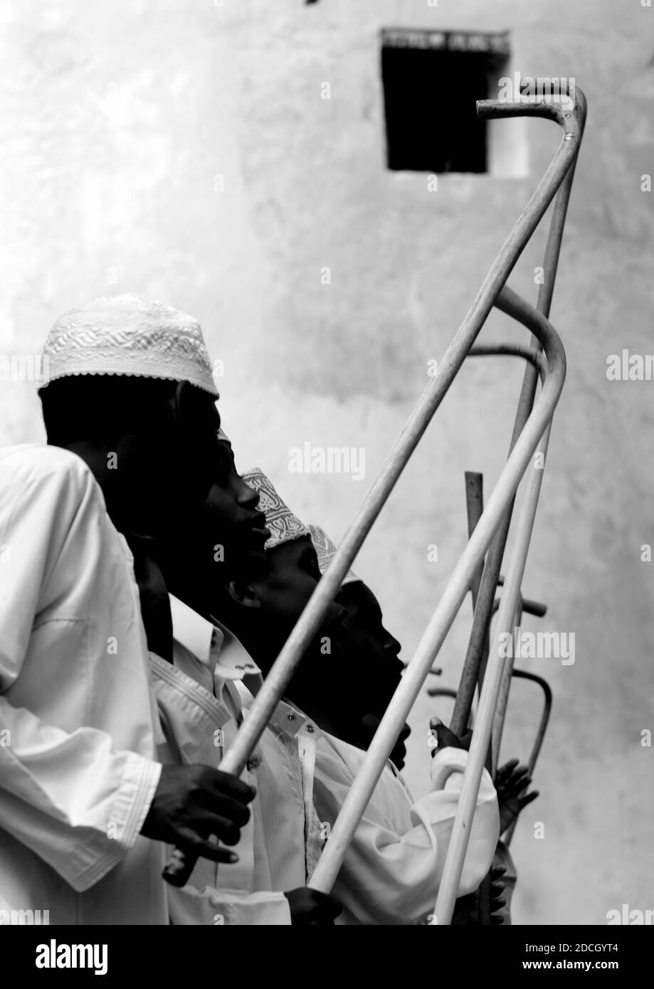 Muslim children dancing with sticks during Maulid festival, Lamu County ...