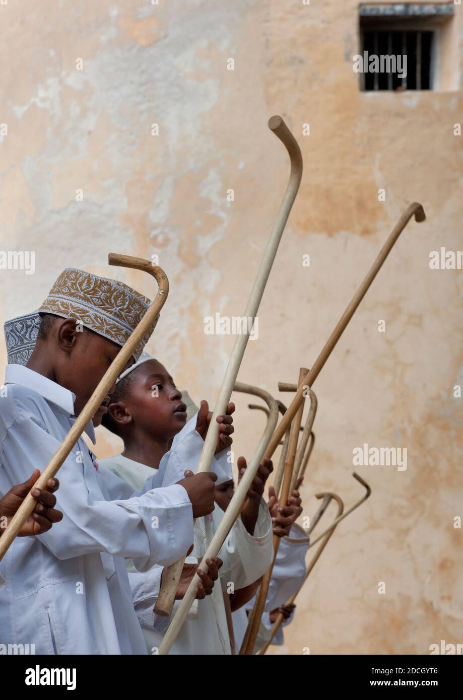 Muslim children dancing with sticks during Maulid festival, Lamu County ...