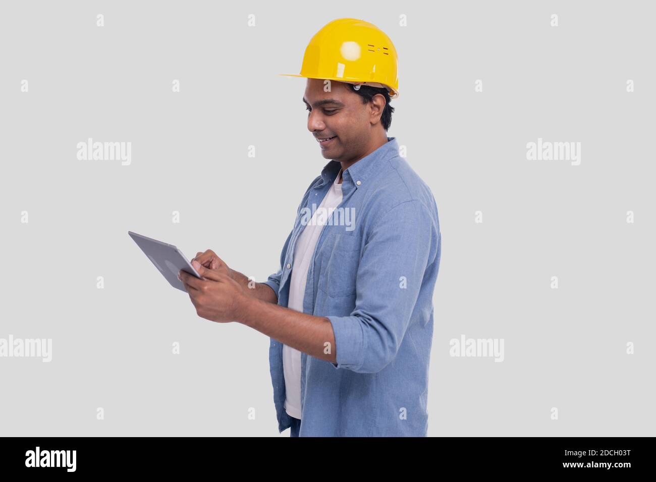 Construction Worker Holding tablet in Hands. Man Using Tablet ...