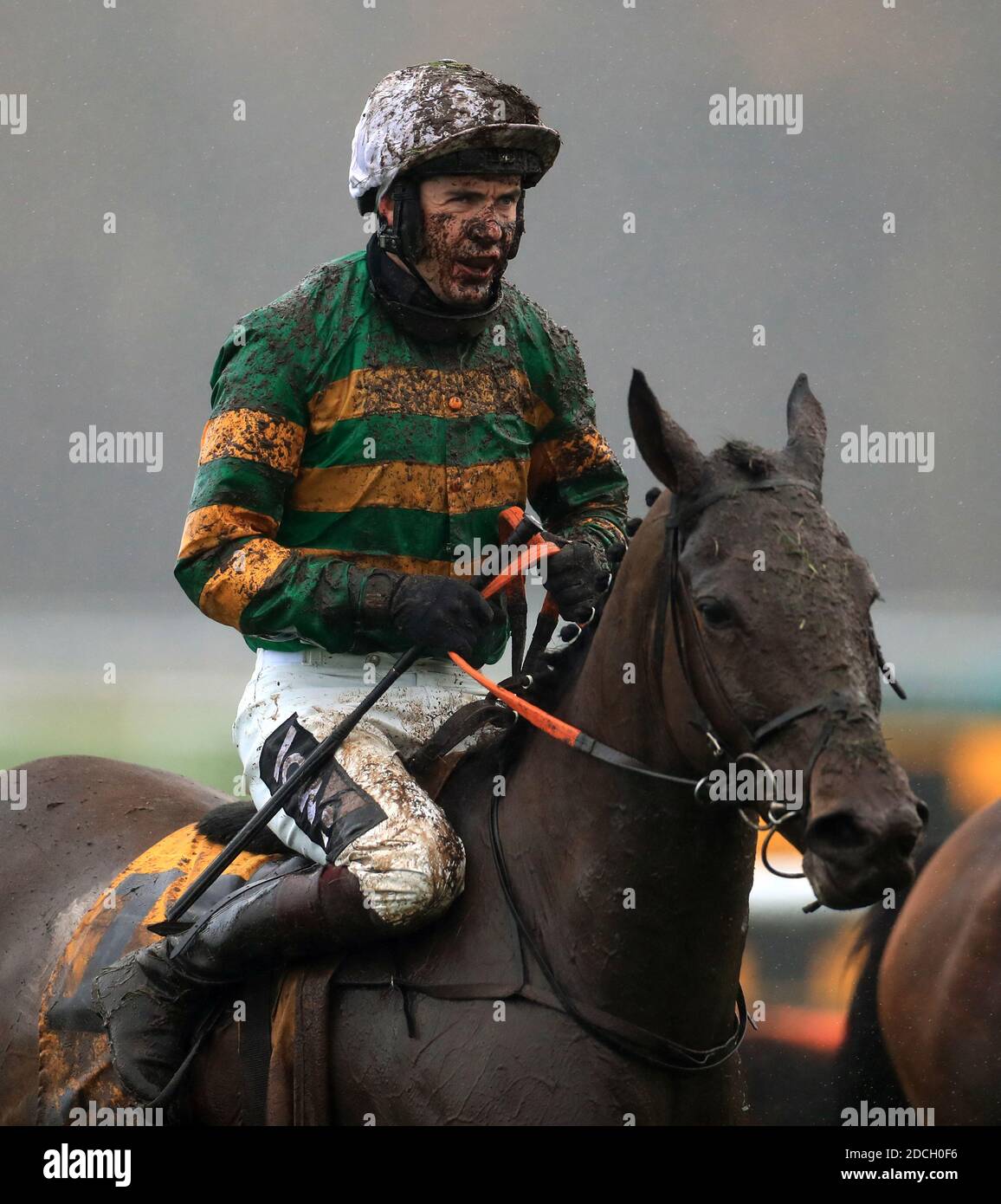 A muddy Aidan Coleman aboard Collooney at Haydock Racecourse Stock ...