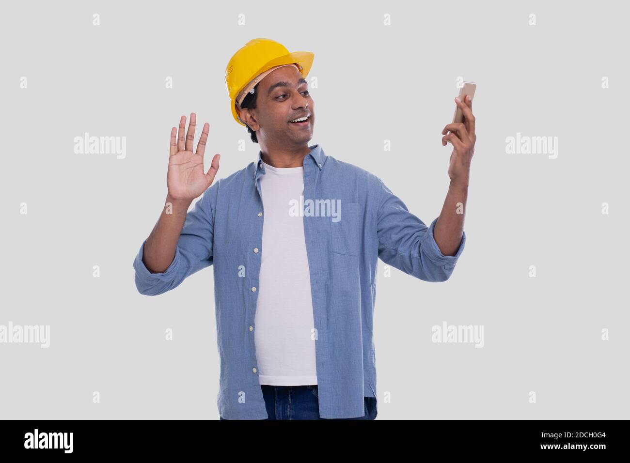 Construction worker having video call on phone hi-res stock photography ...
