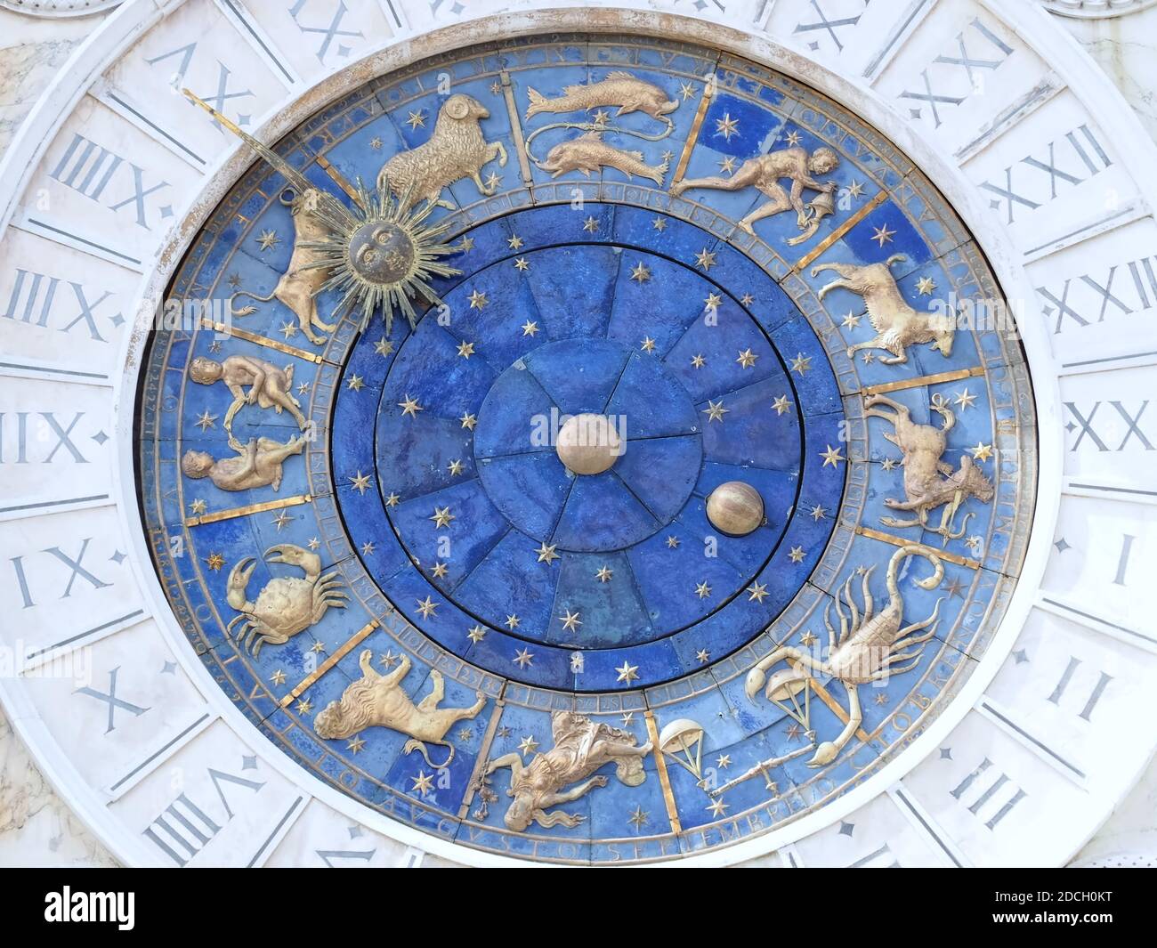 Interesting sundial with a golden sun Stock Photo - Alamy