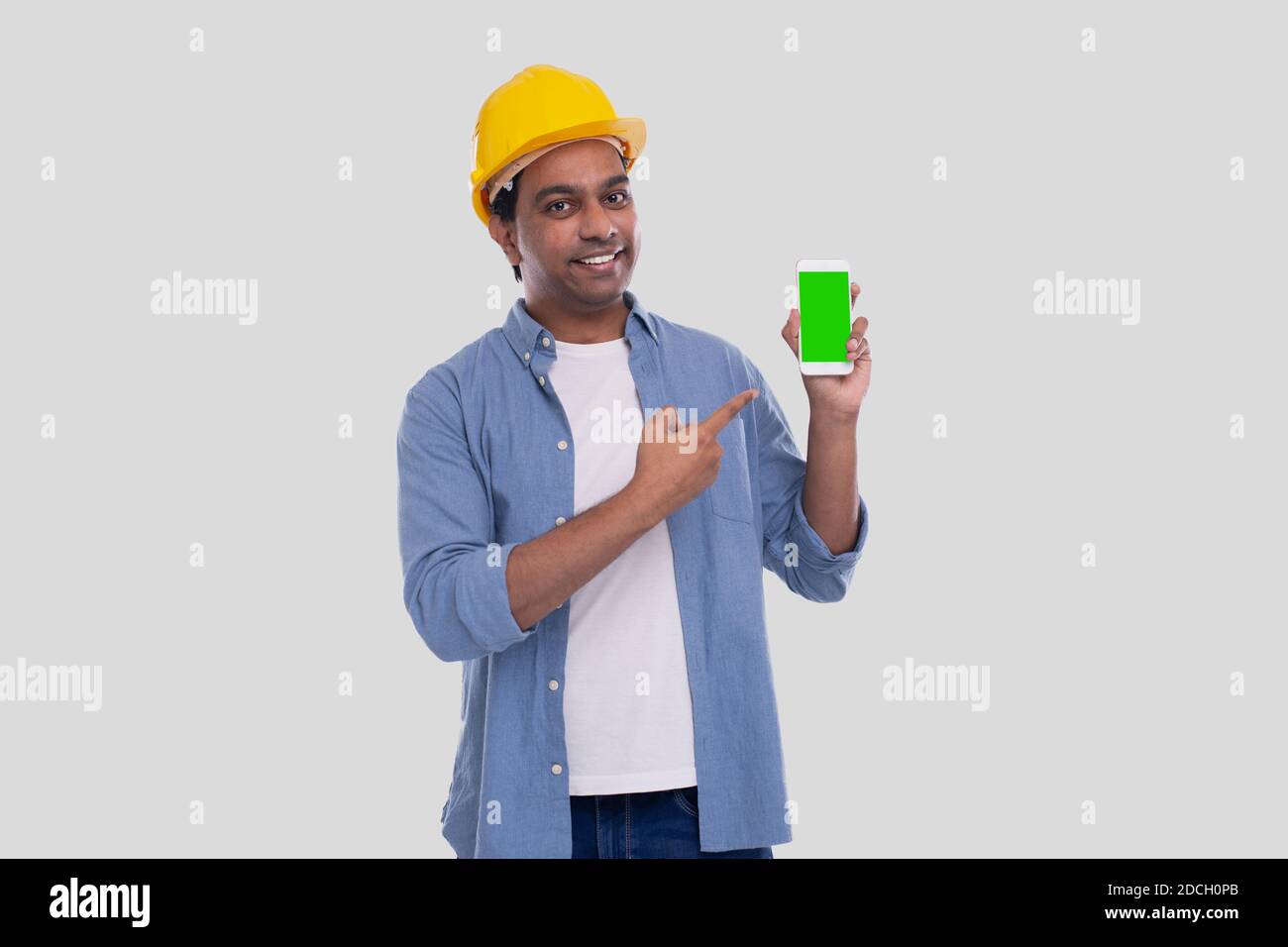 Construction Worker Indian Man Pointing at Phone. Man Pointing at Phone ...