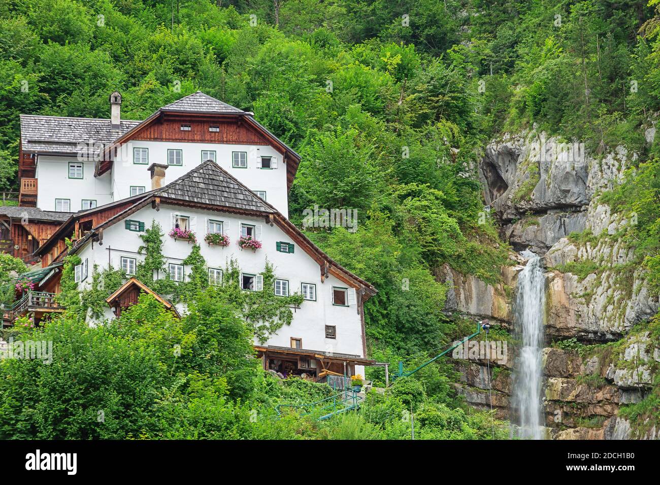 Idyllic waterfall in Hallstatt seen from the village centre Stock Photo ...