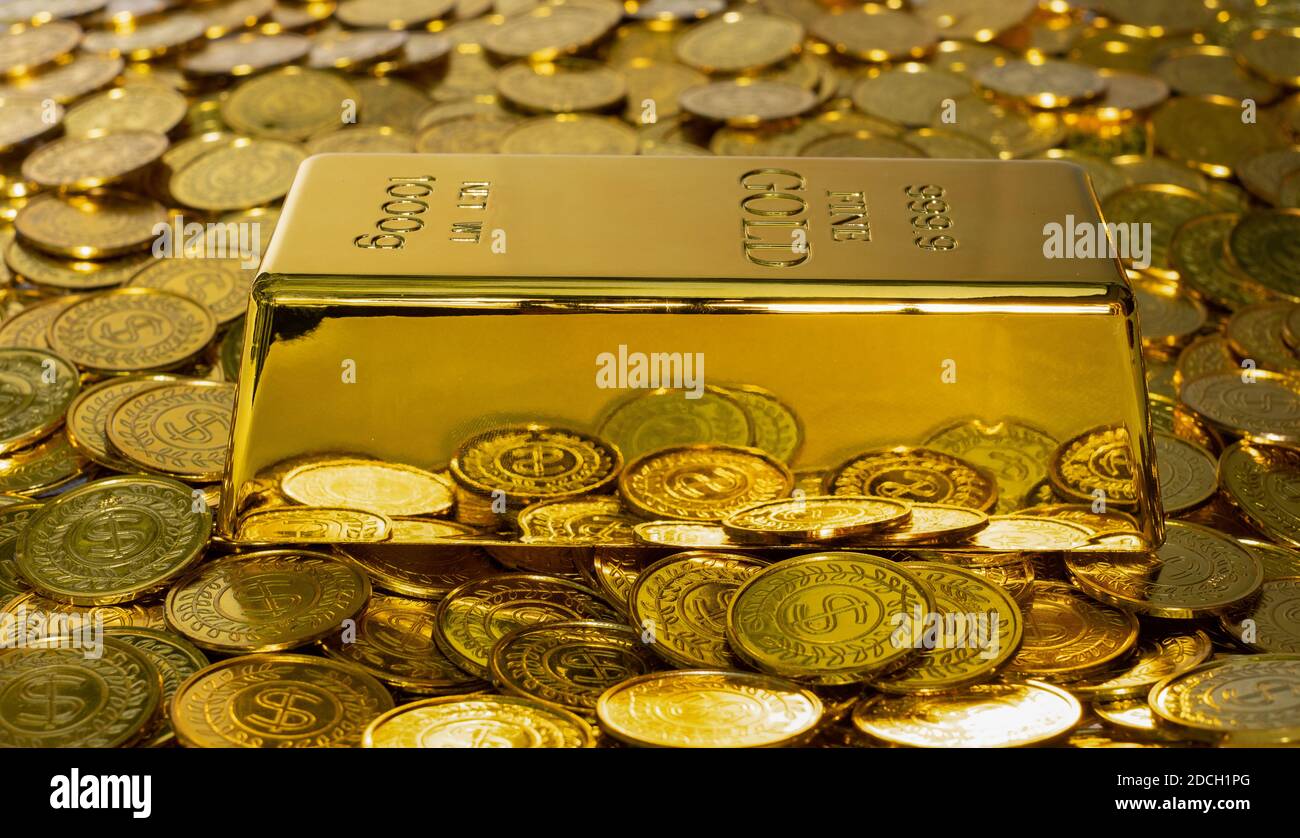 Closeup shiny gold bar 1 kg on the stack gold coin a lot of Stock Photo ...