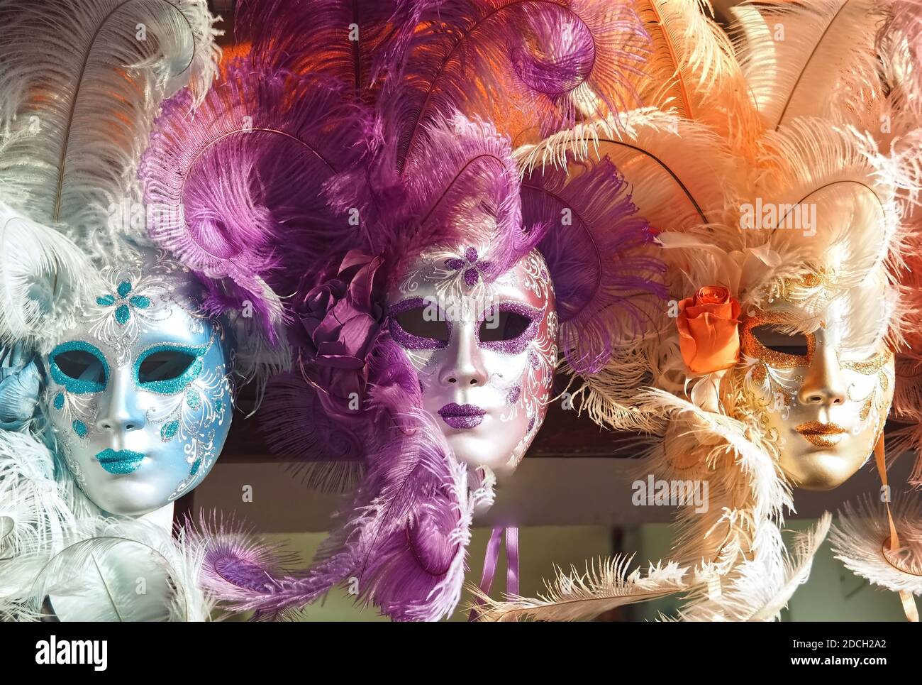 Colorful face masks in Venice with big feathers Stock Photo - Alamy