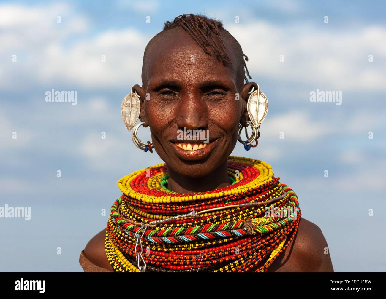 Smiling Turkana tribe woman with necklaces and earrings, Rift Valley ...