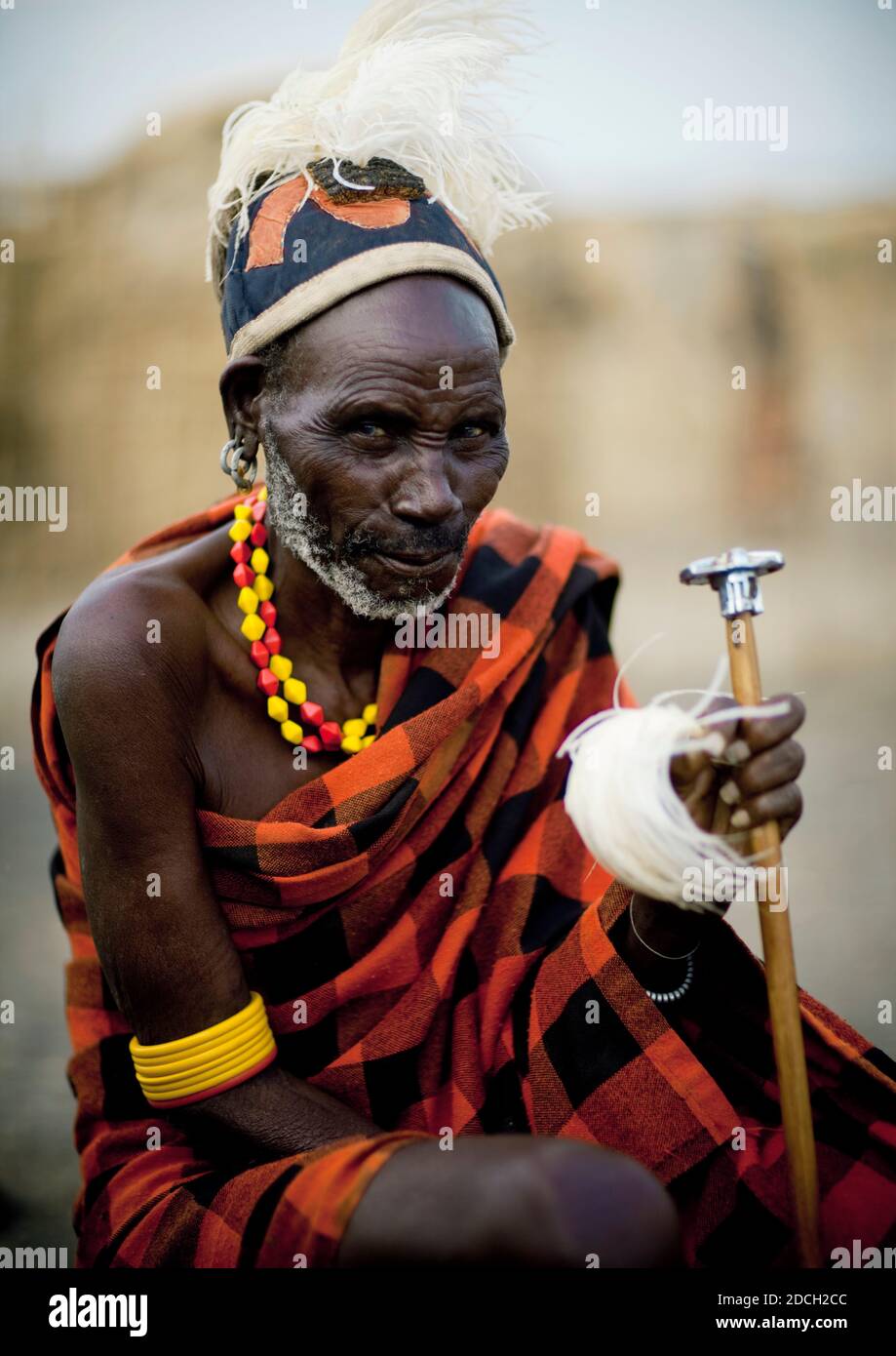 Portrait of a Turkana tribe man with ostrich feathers on the headwear ...