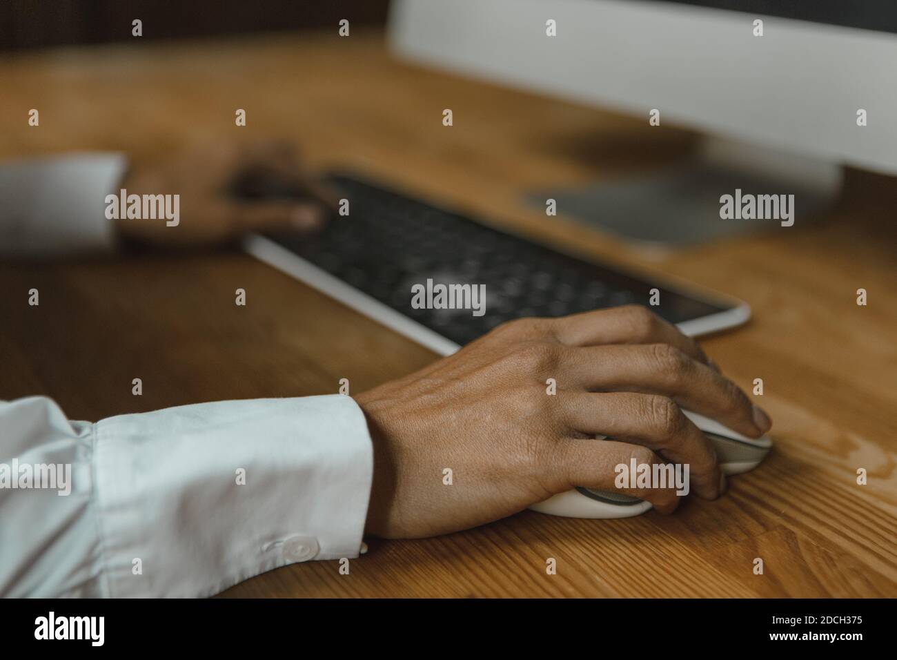 Woman's hands on keyboard and holding computer mouse sitting in from of ...