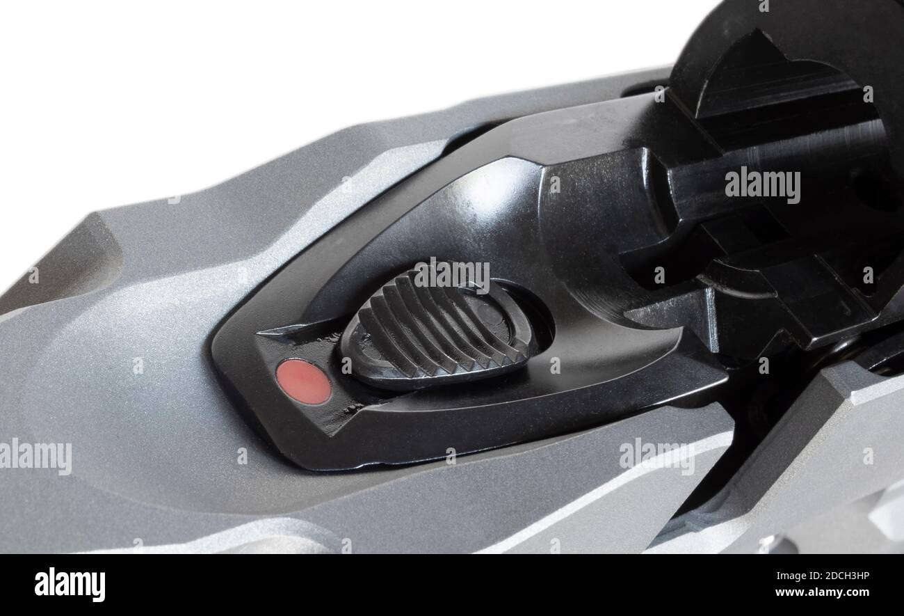 Tang mounted safety on a bolt action rifle that is in a ready to fire ...