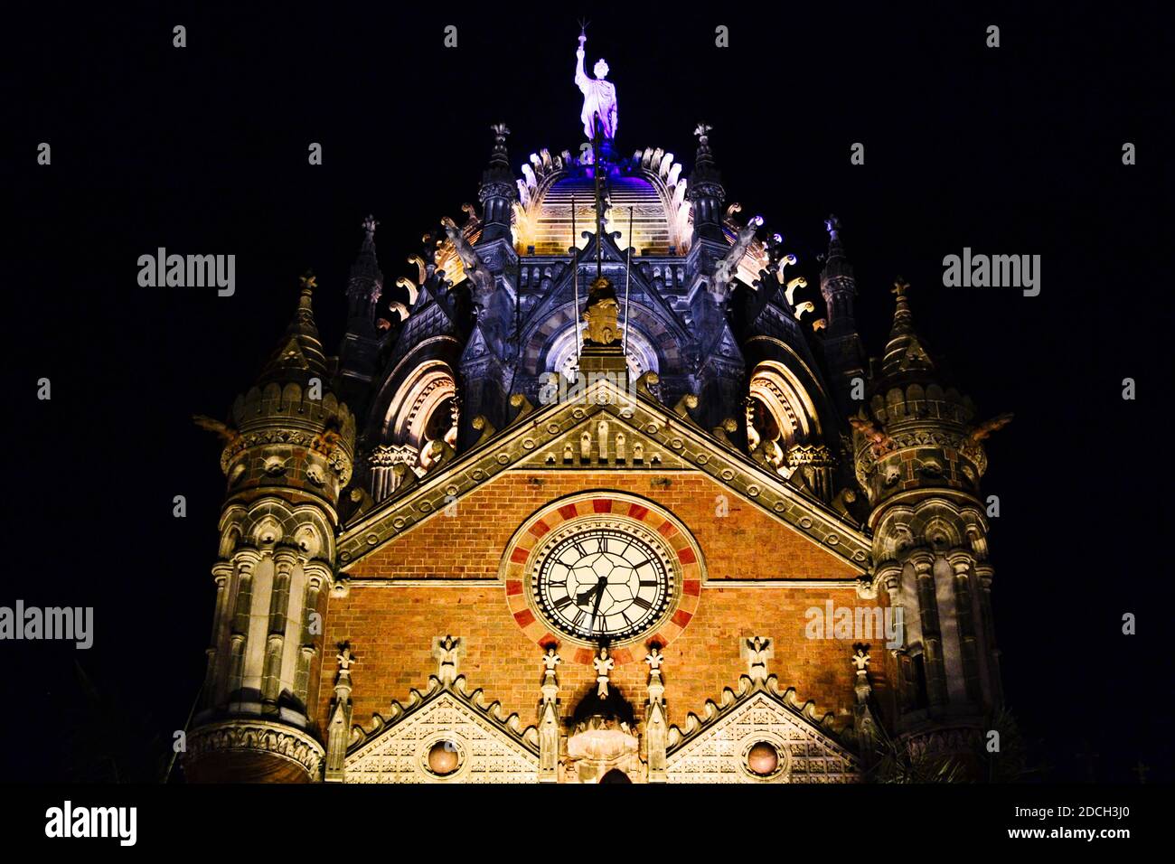 Chhatrapati Shivaji Terminus CST at night. Illuminated central building ...