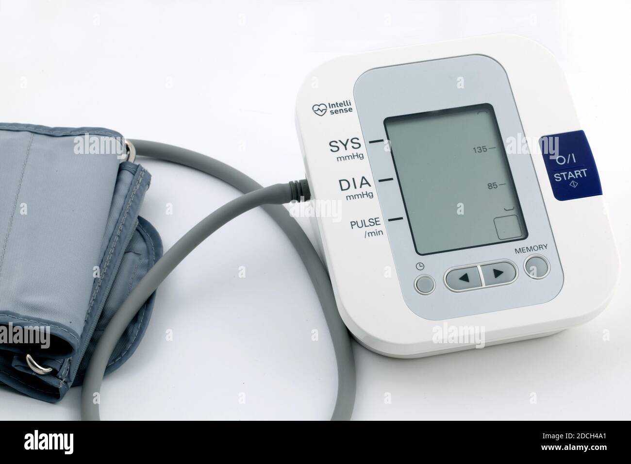 A high angle shot of a digital blood pressure machine isolated on white ...
