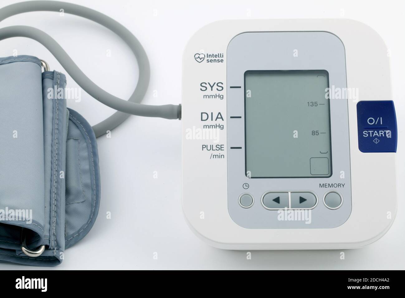 A high angle shot of a digital blood pressure machine isolated on white ...