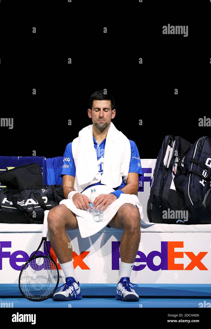 Novak Djokovic sits on his bench during a change of ends in his match ...