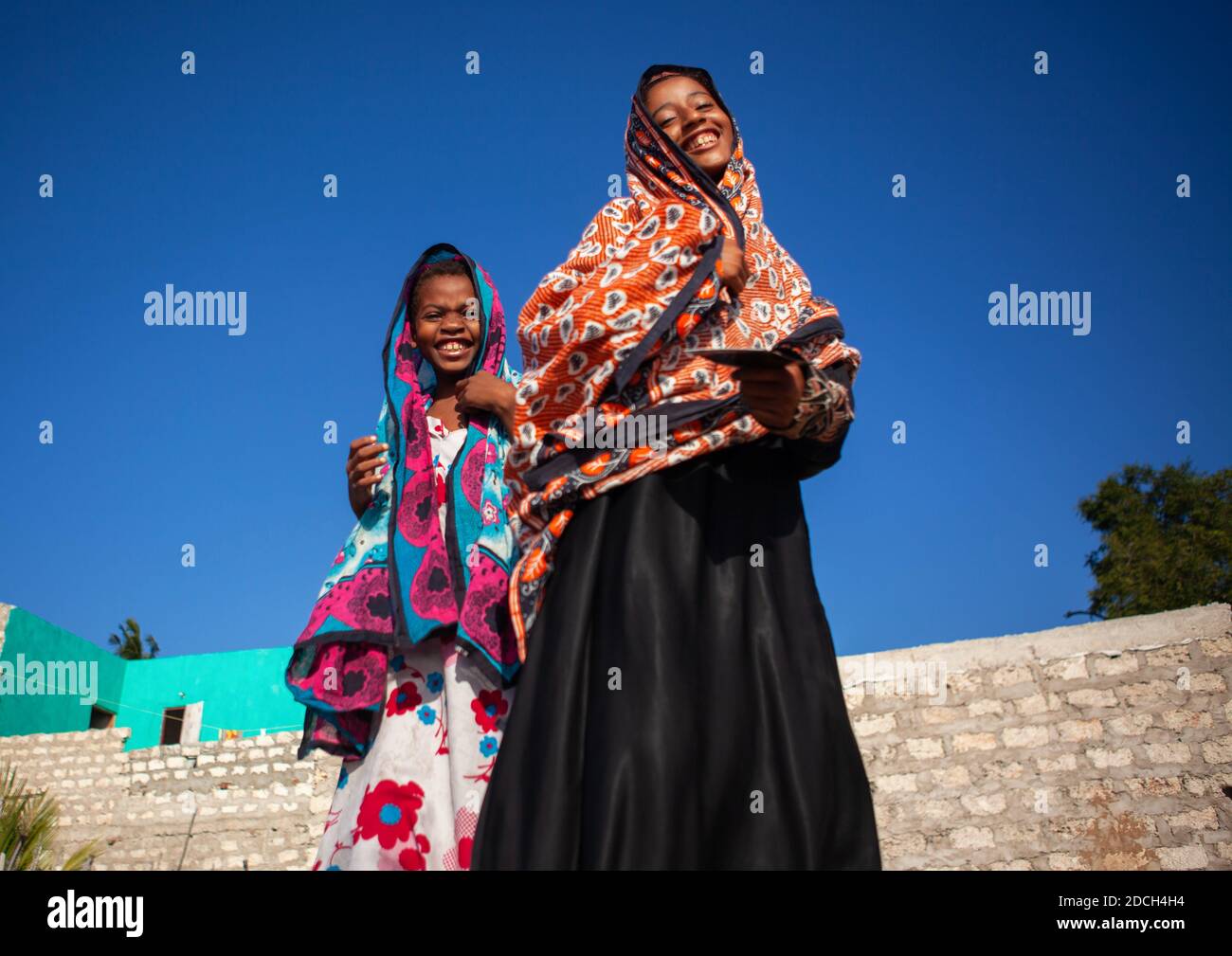 Smiling muslim teenage girls with colorful veils, Lamu County ...