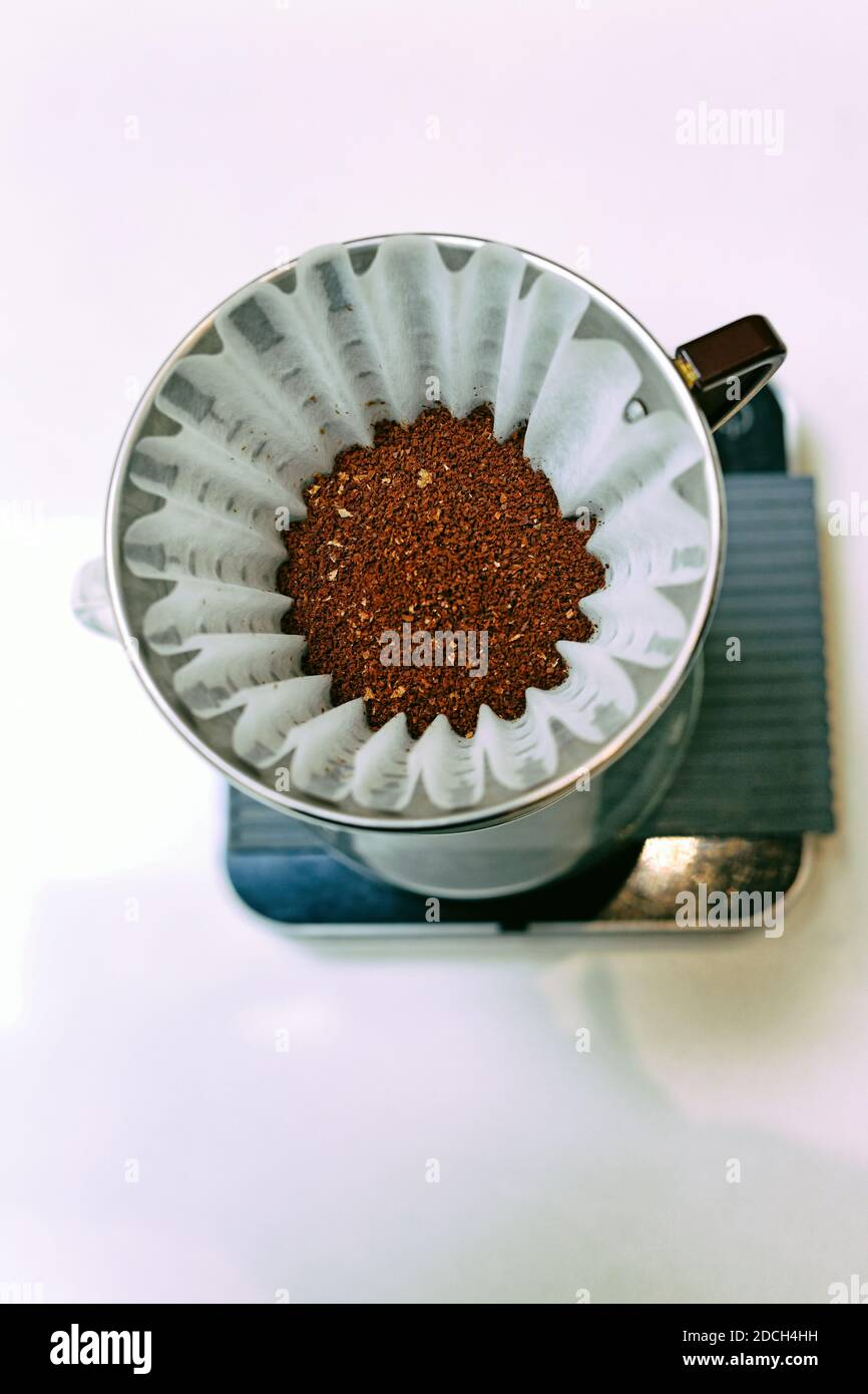 Ground coffee in filter white background overhead view Stock Photo - Alamy