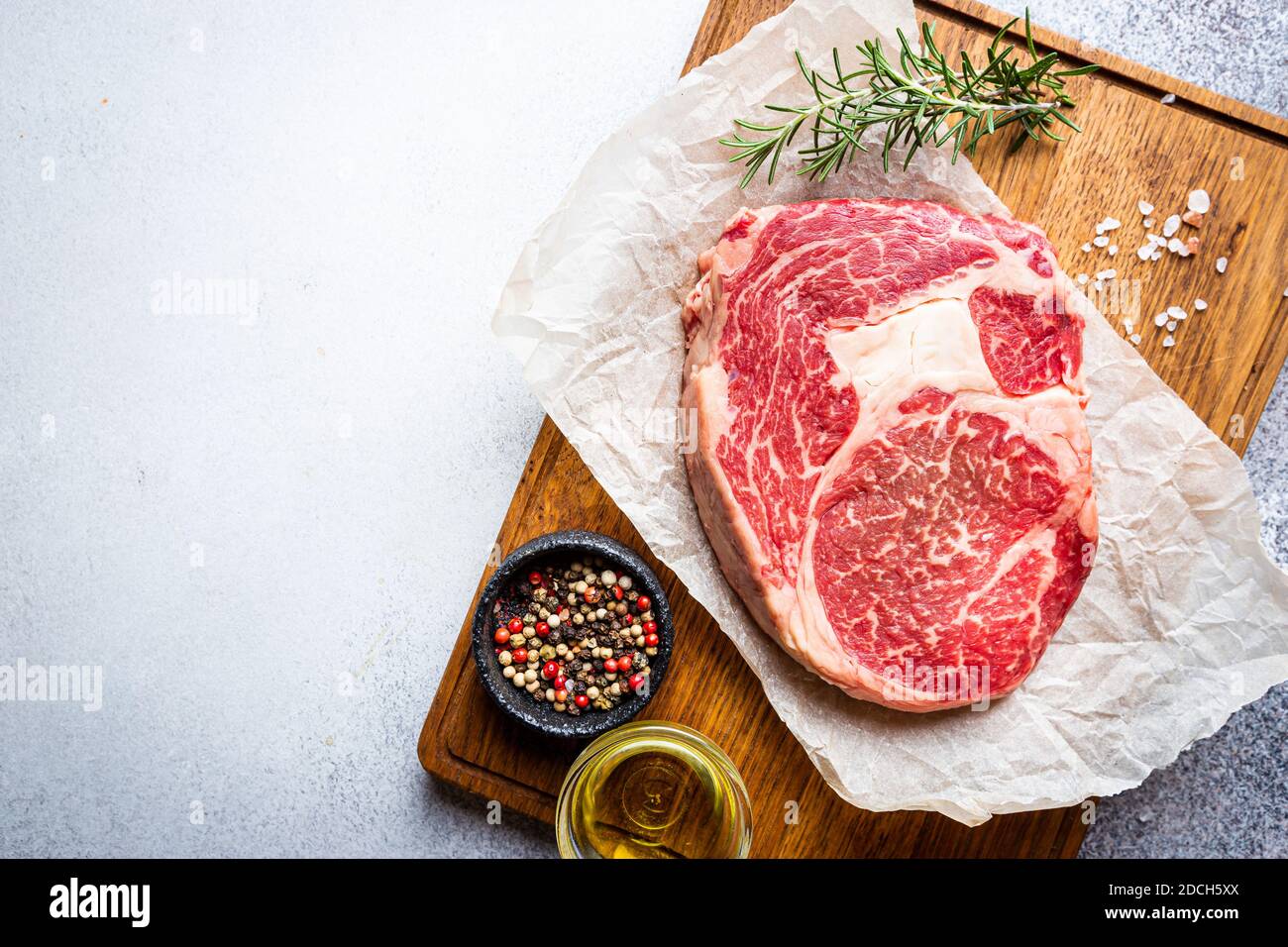 Raw fresh meat Ribeye Steak and seasonings on light background, top ...
