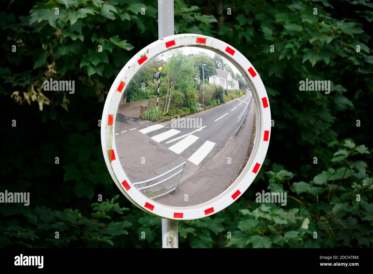 Round mirror to assistance car reversing on to blind bend Stock Photo ...