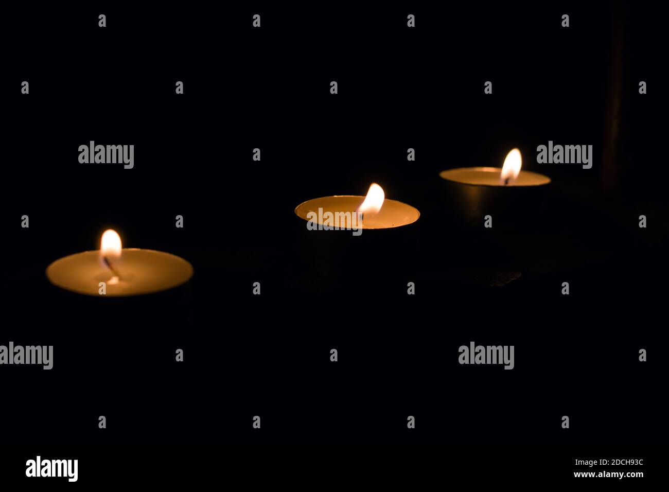 Small candles light up dark hi-res stock photography and images - Alamy