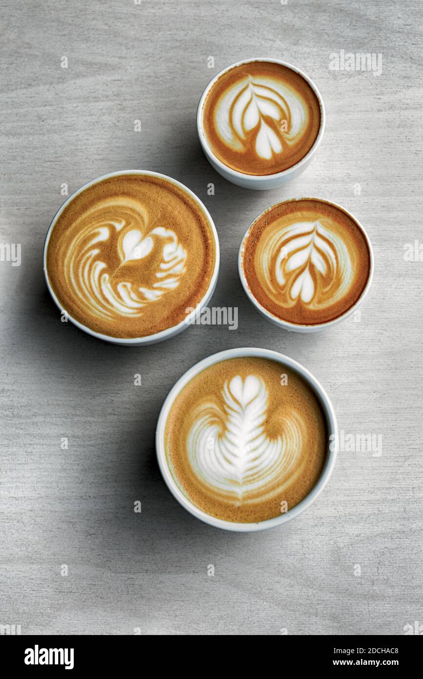 Aerial view of various hot coffee drinks with latte art Stock Photo - Alamy