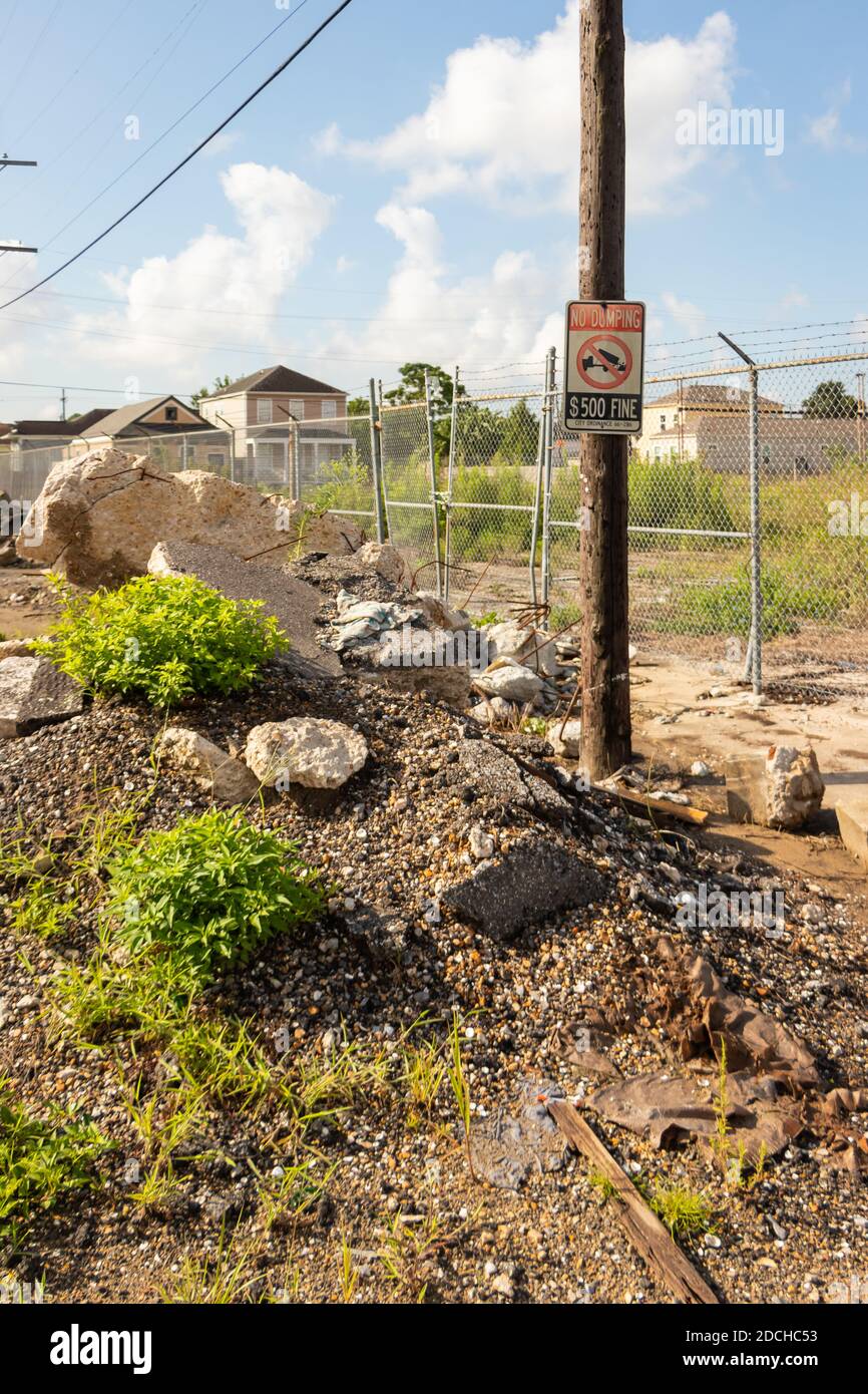 trash dumped on road with ironic no dumping sign in New Orleans ...