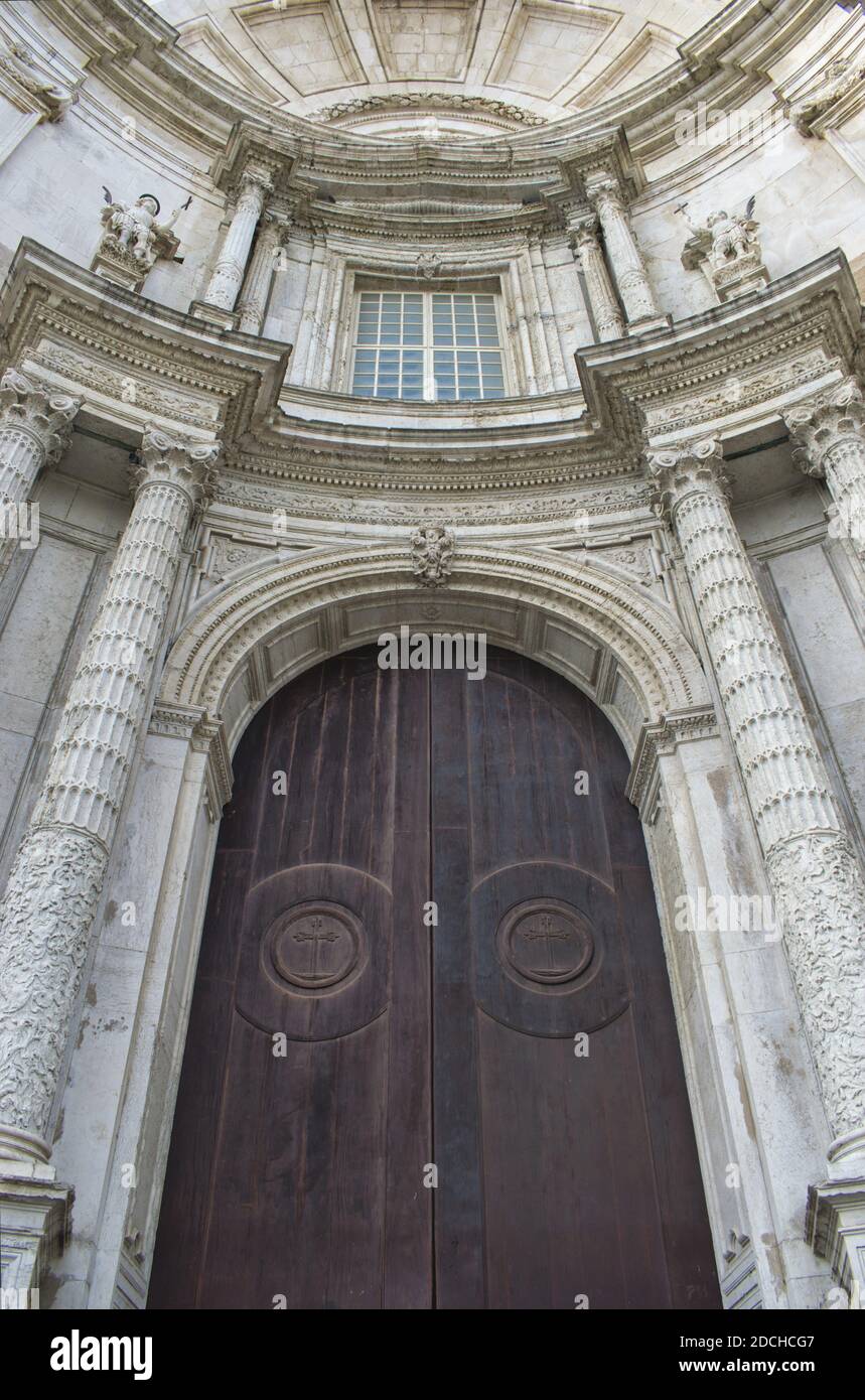 A vertical shot of the door and arch of access to the cathedral of ...