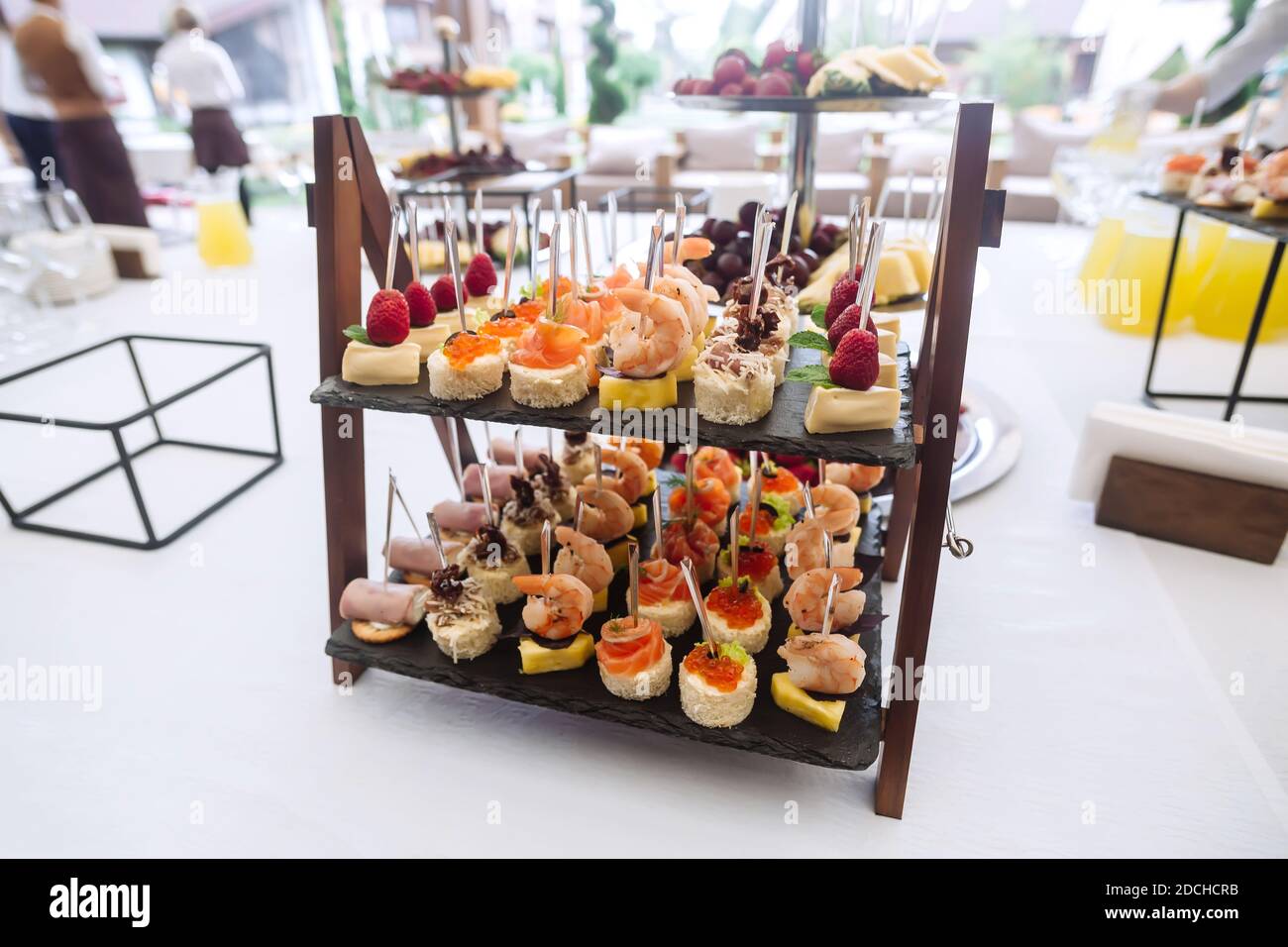 Different light snacks on tray at the table on wedding party Stock ...