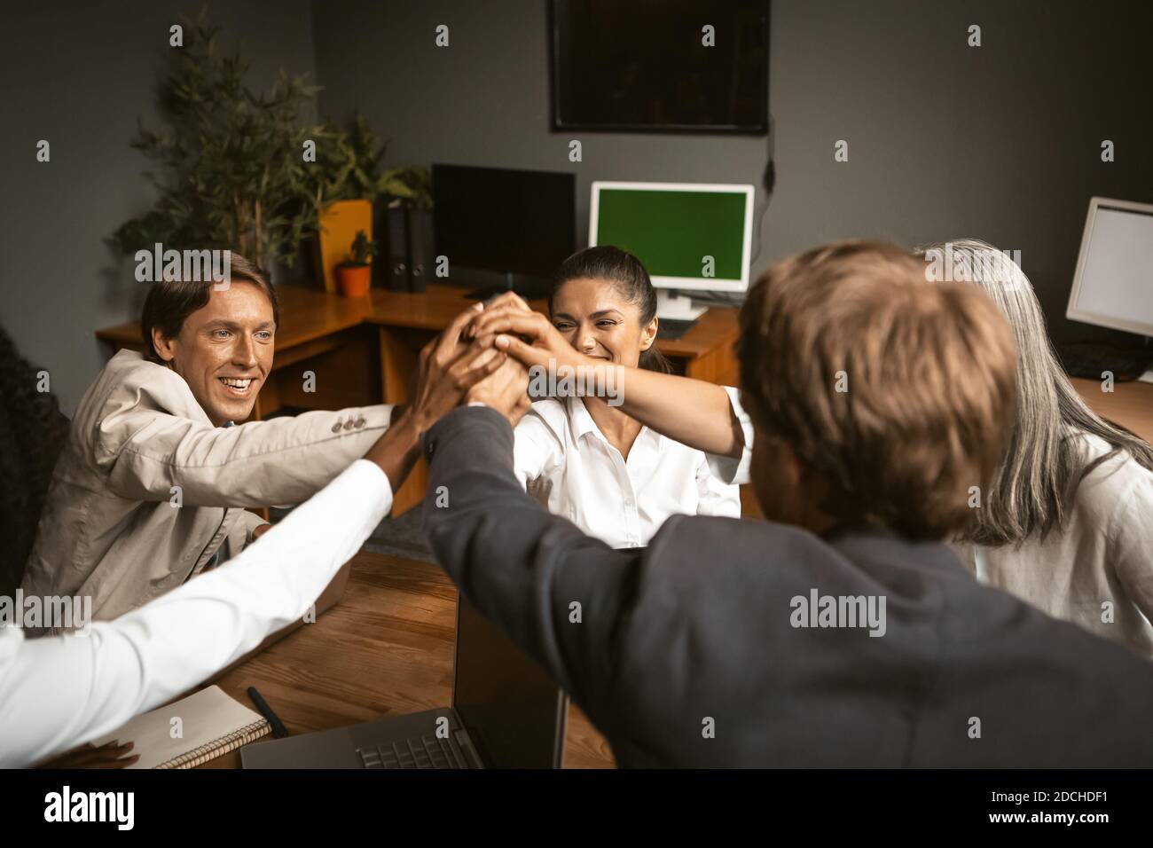 Teamwork. a group of young businessmen came together to create a ...